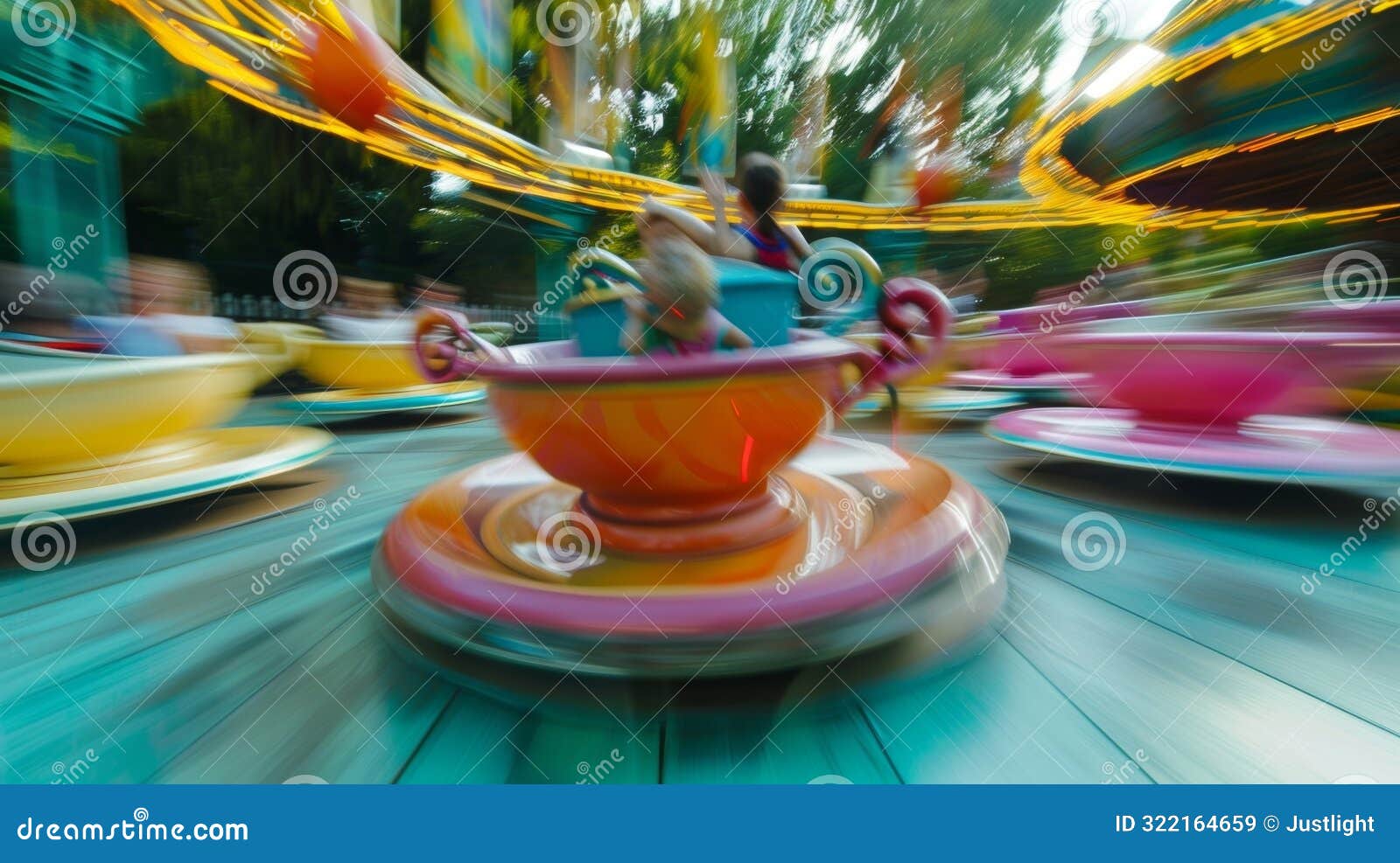 A Distorted View of Dizzying Fun on the Spinning Teacup Ride Stock ...