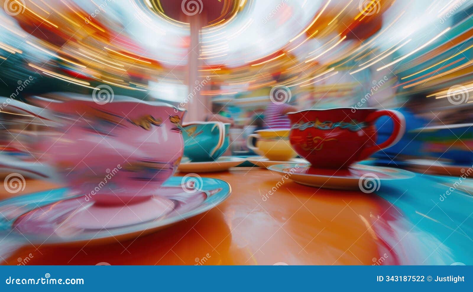 A Distorted View of Dizzying Fun on the Spinning Teacup Ride Stock ...