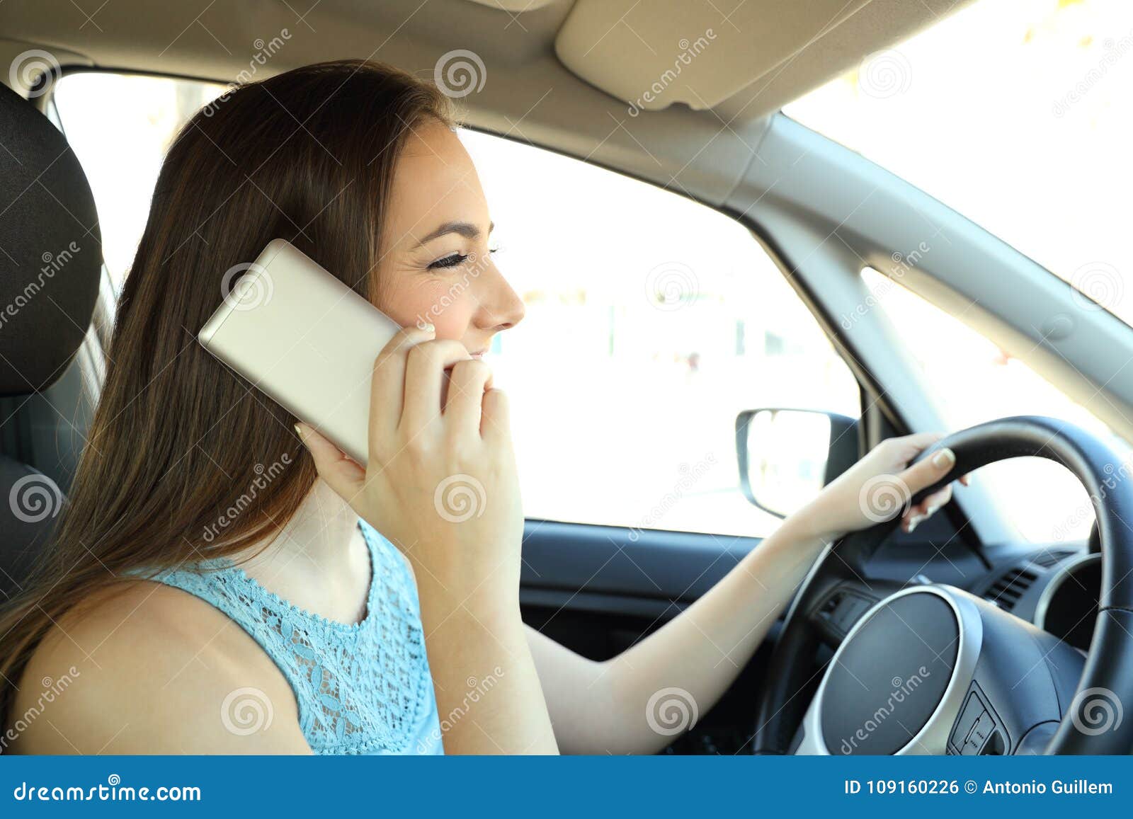 Distracted Driver Calling on Phone Driving a Car Stock Photo - Image of ...