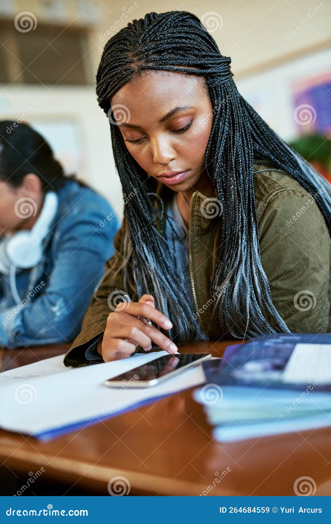 Distracted by Her Cellphone. an Attractive Young University Student ...