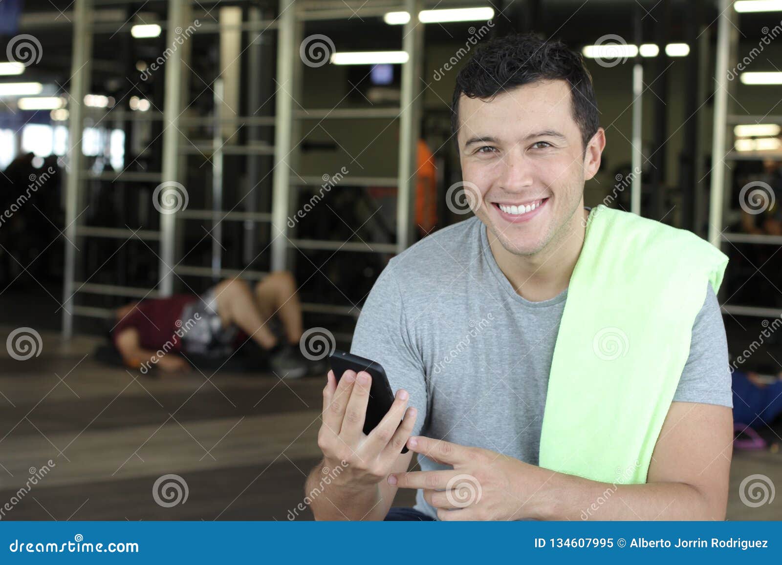 Distracted Man with Cellphone at the Gym Stock Image - Image of ...