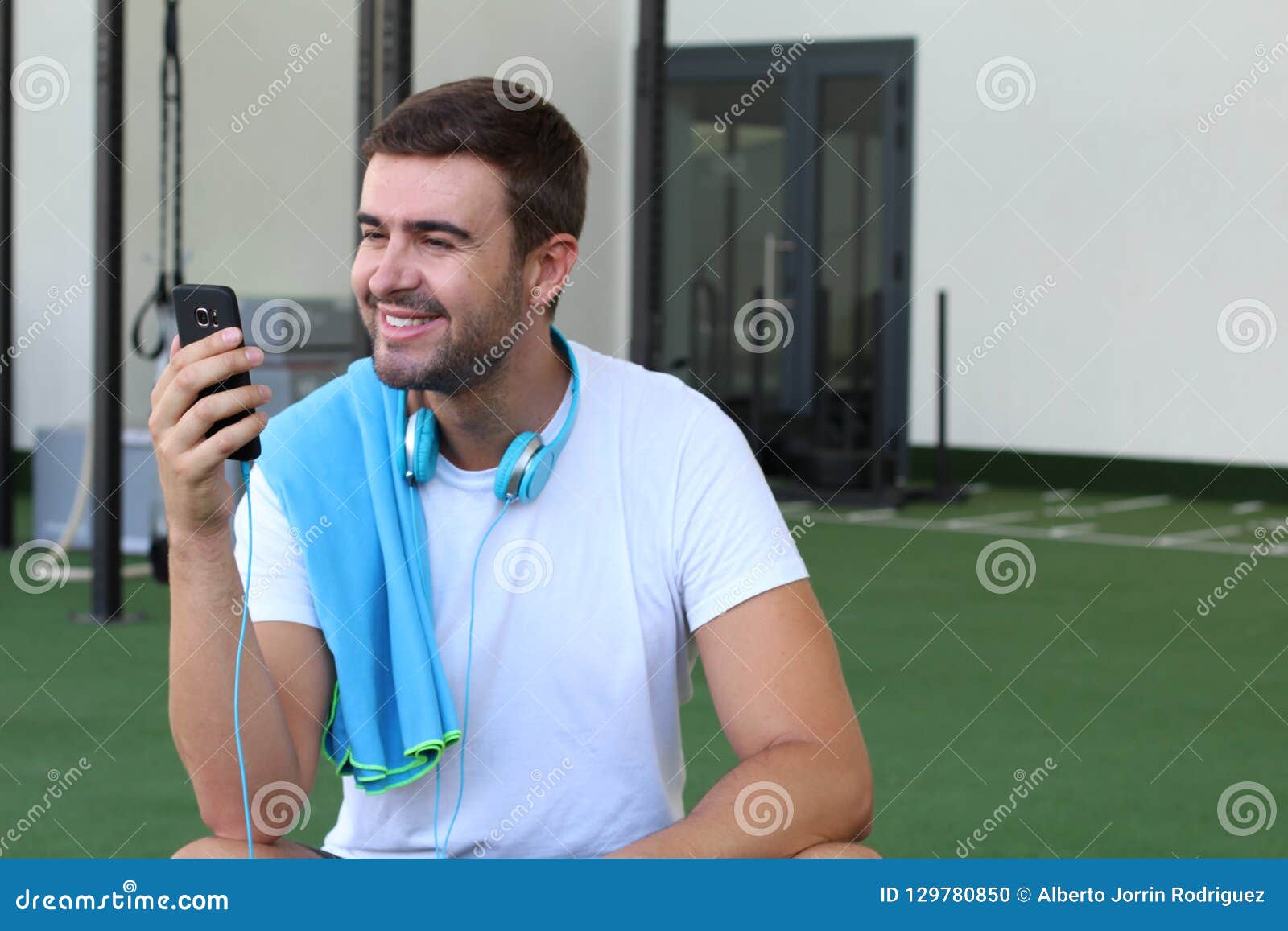Distracted Man with Cellphone at the Gym Stock Photo - Image of adult ...