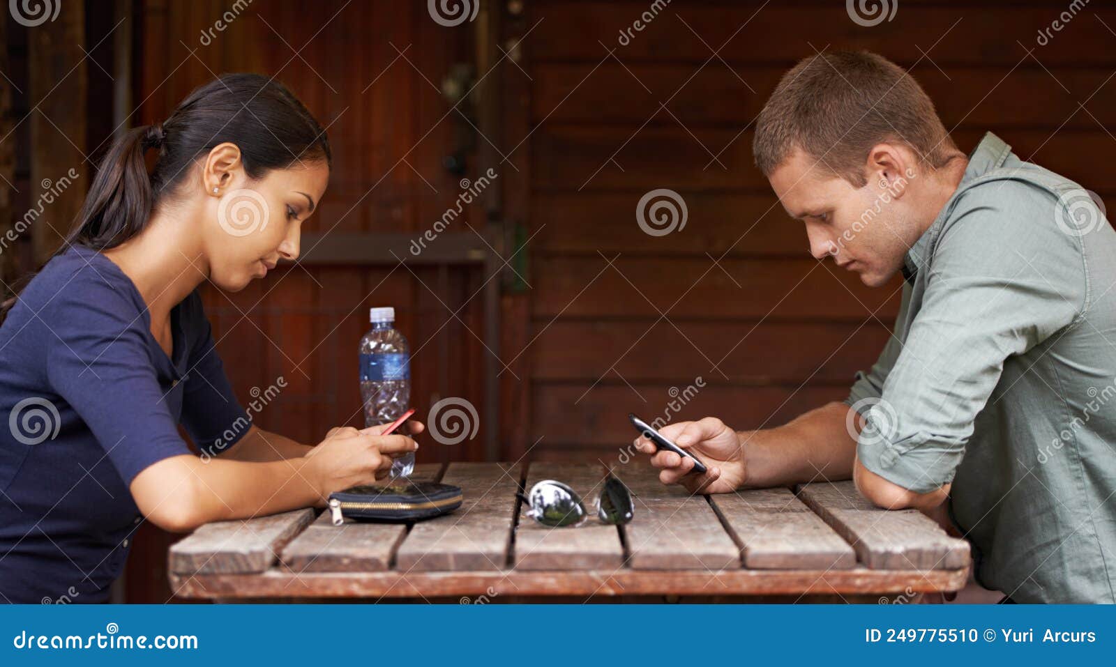 Distracted by Technology. Two Young Adults Being Distracted by ...