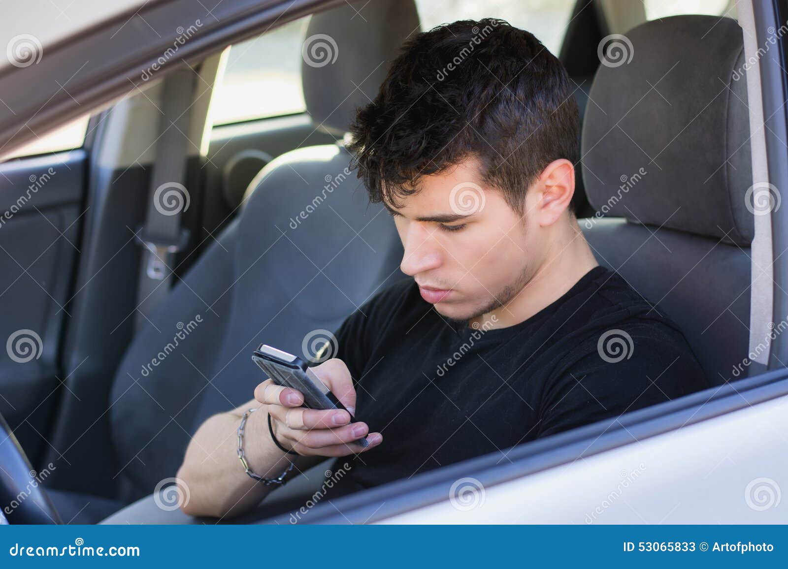 Distracted Young Man Using Cell Phone while Stock Image - Image of fine ...