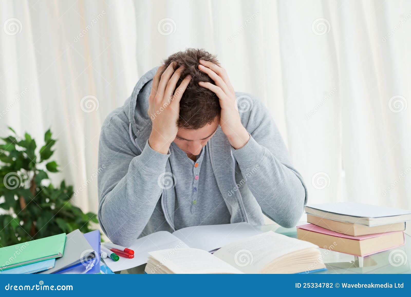 Distressed Student In Front Of His Books Stock Photography - Image ...