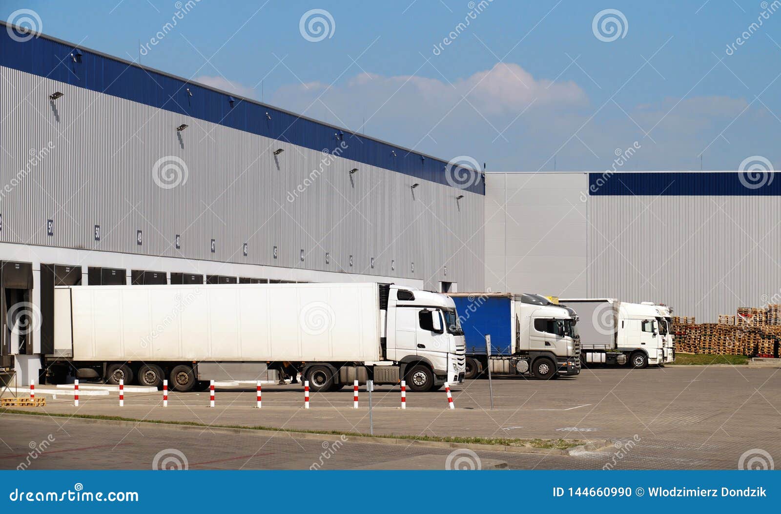 Distribution Centre. Loading and Unloading of Goods Onto Trucks Stock ...