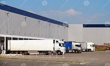 Distribution Centre. Loading and Unloading of Goods Onto Trucks Stock ...
