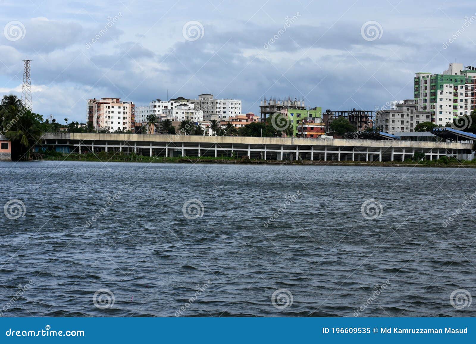 District Cityscape from a Park and Lake View. and a Cricket Stadium ...