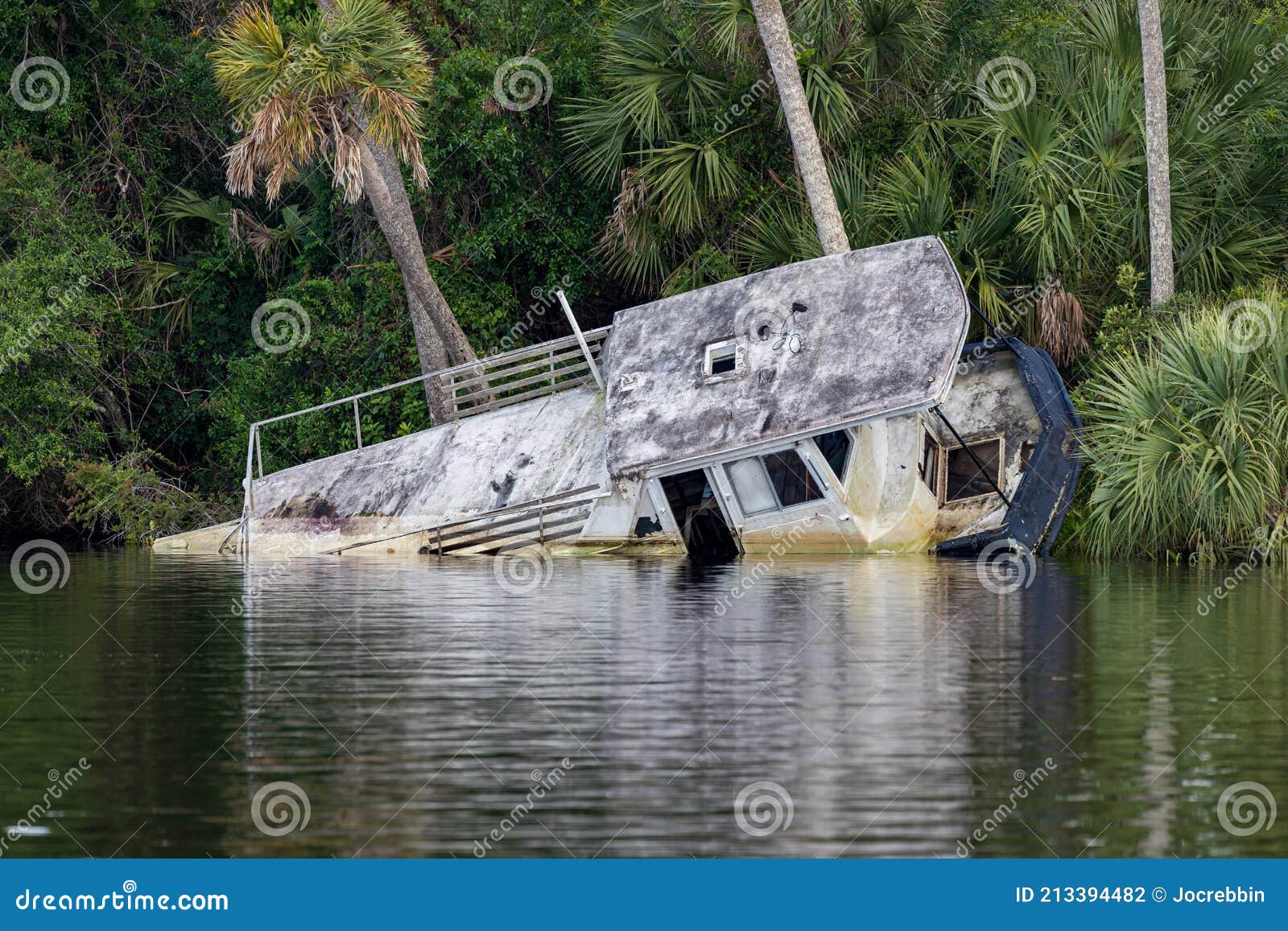 Destroyed Flat Bottom Barge Style Boat Rests on Its Side, Damaged by ...