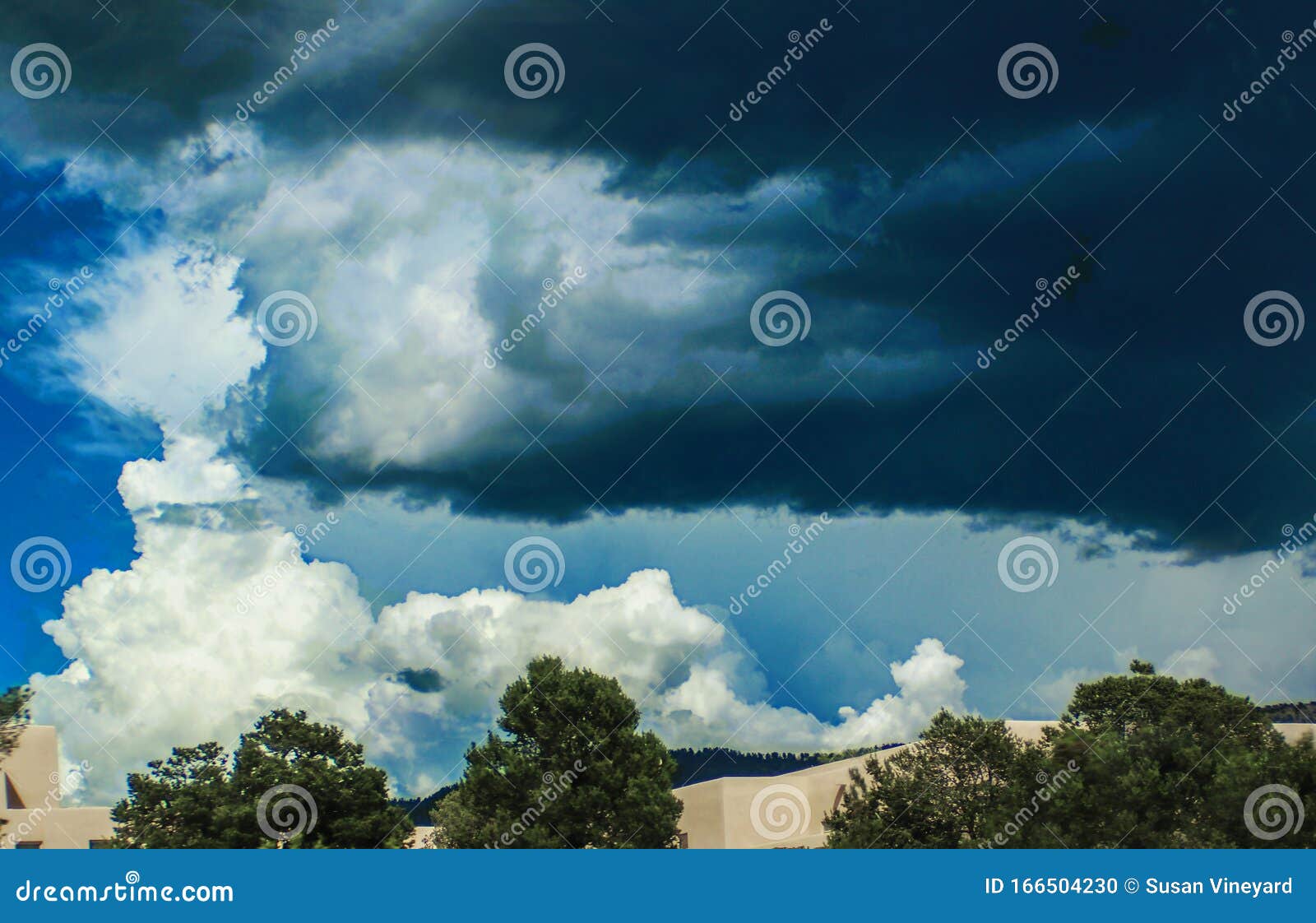 Disturbingly Strange Storm Clouds Over Stucco Buildings Stock Photo ...