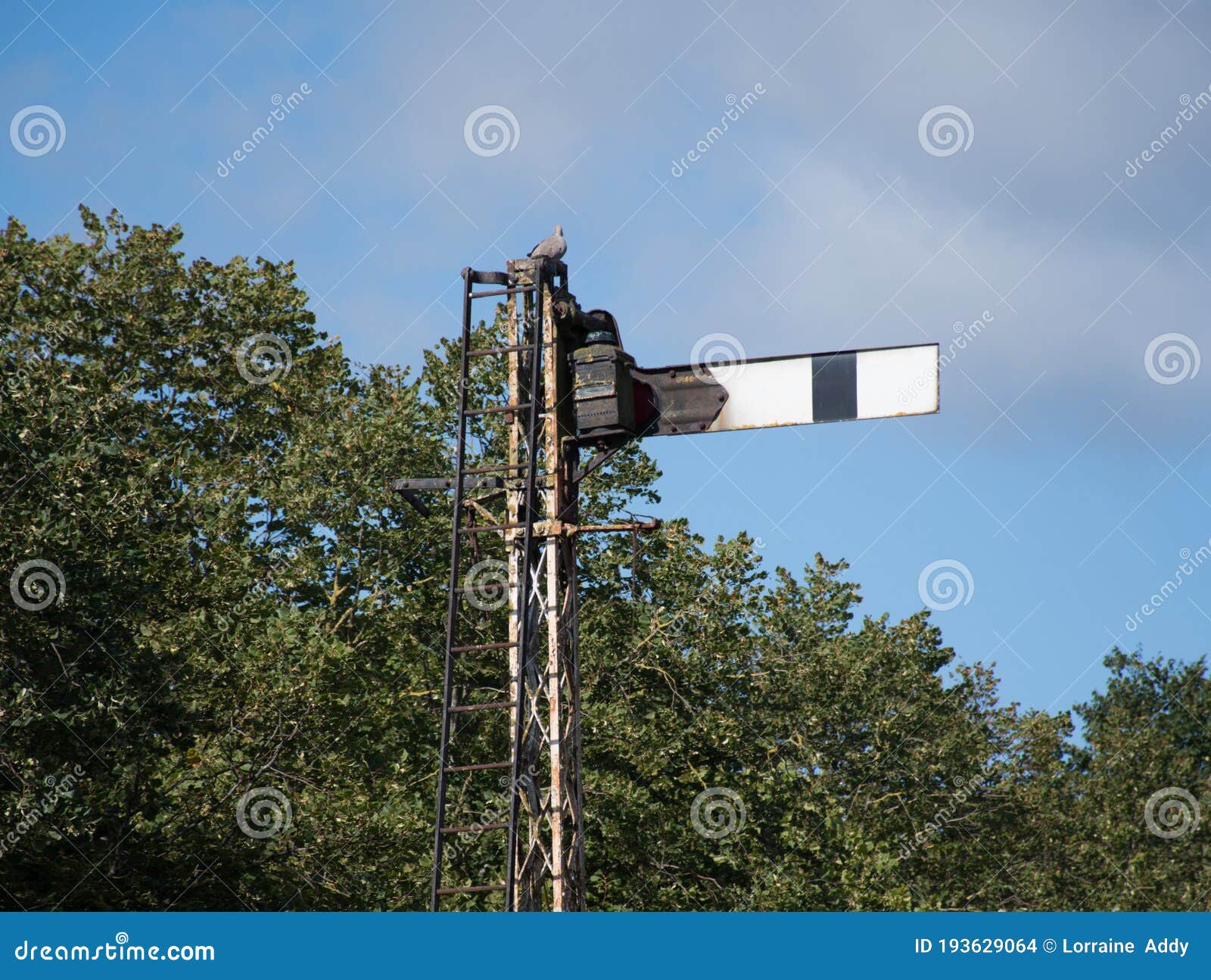 Disused Train Signal with a Blue Sky and Trees Stock Photo - Image of ...