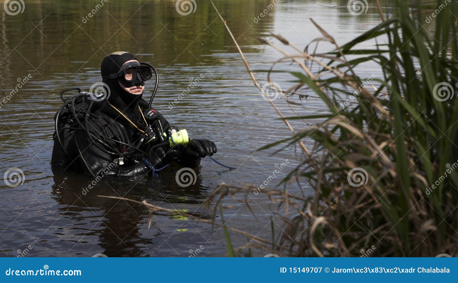 Fire Diver Performing Off The High Dive Platform Head First Into A Pool ...