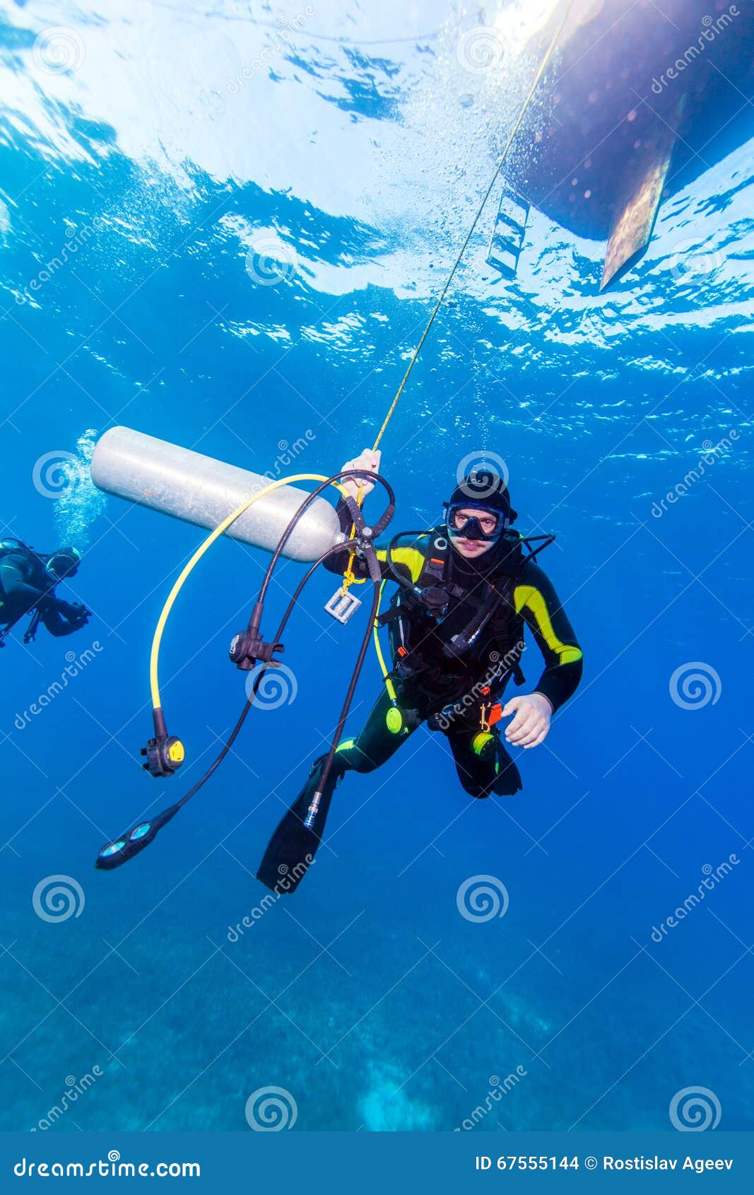 Diver with additional tank stock photo. Image of stage - 67555144