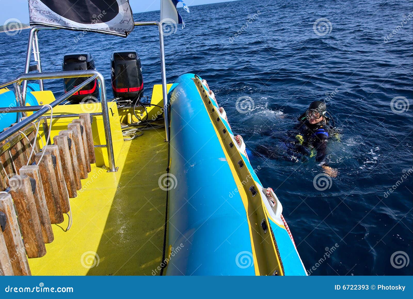 Diver Floats in Water Next To White-blue Boat Stock Image - Image of ...
