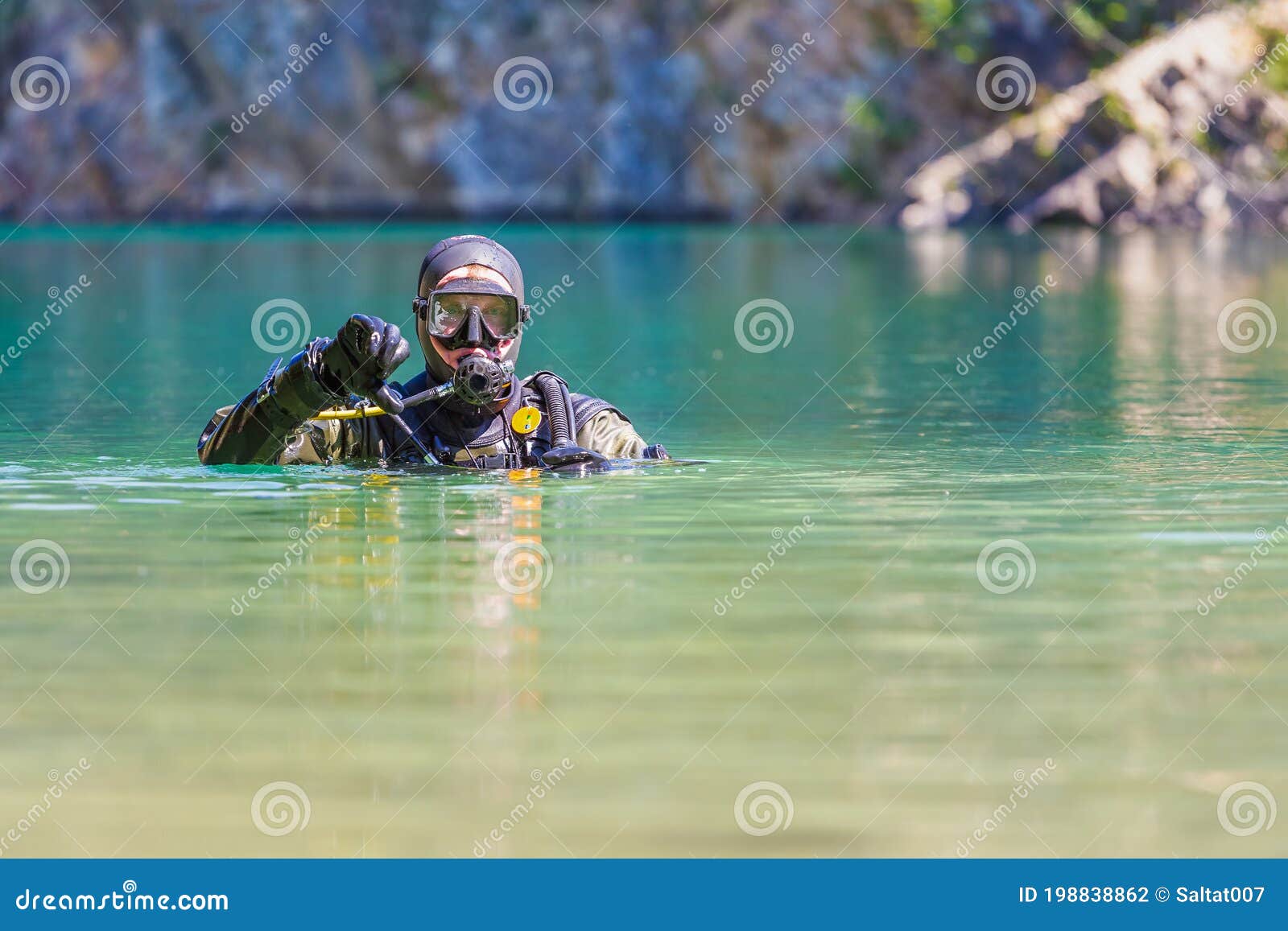 Diver Looking at the Camera. Head on the Surface. Gestures that he Goes ...