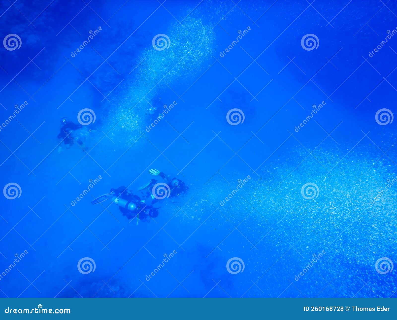 Divers with Many Bubbles in the Blue Deep of the Sea Stock Photo ...