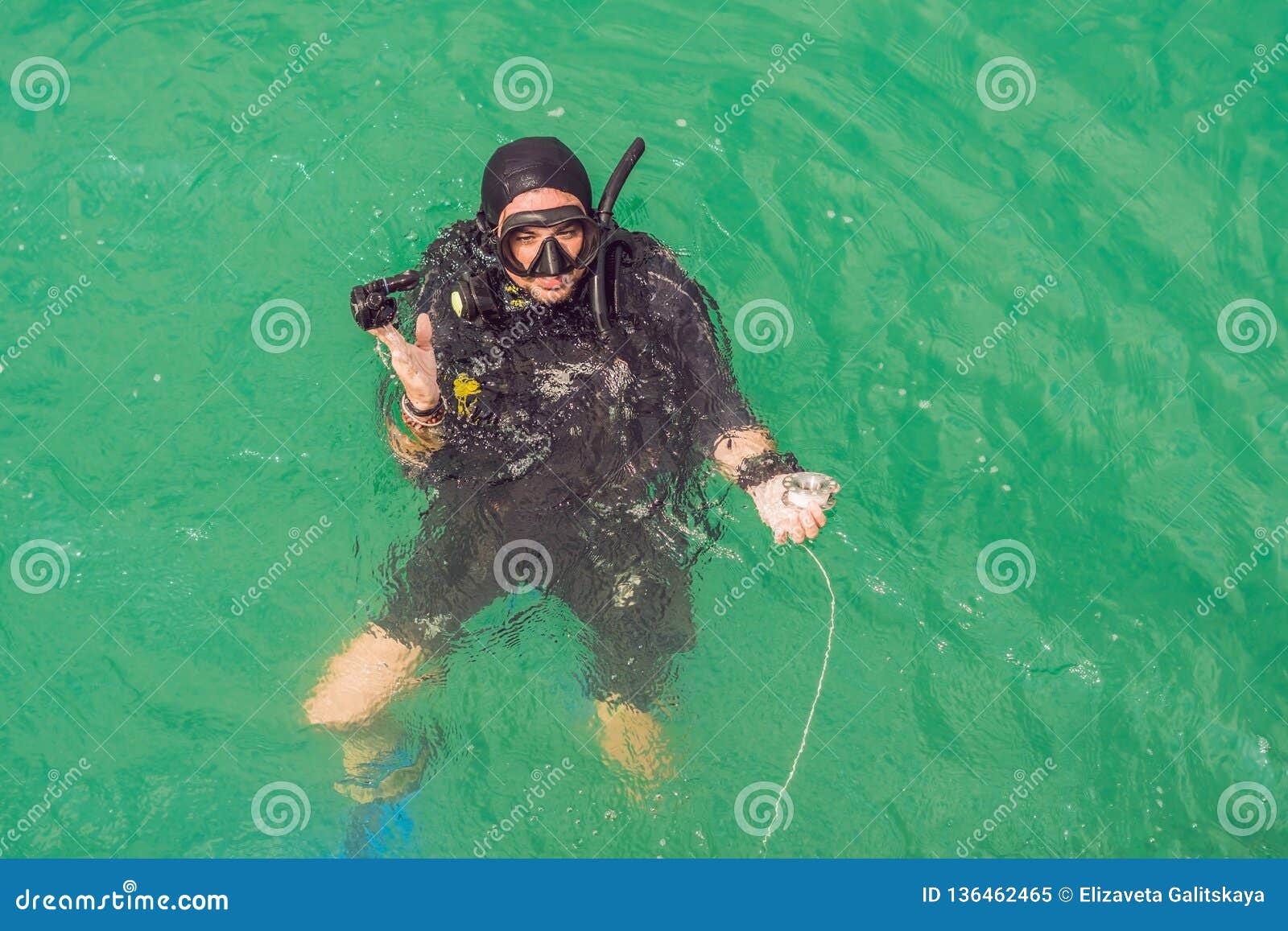 Divers on the Surface of Water Ready To Dive Stock Image - Image of ...
