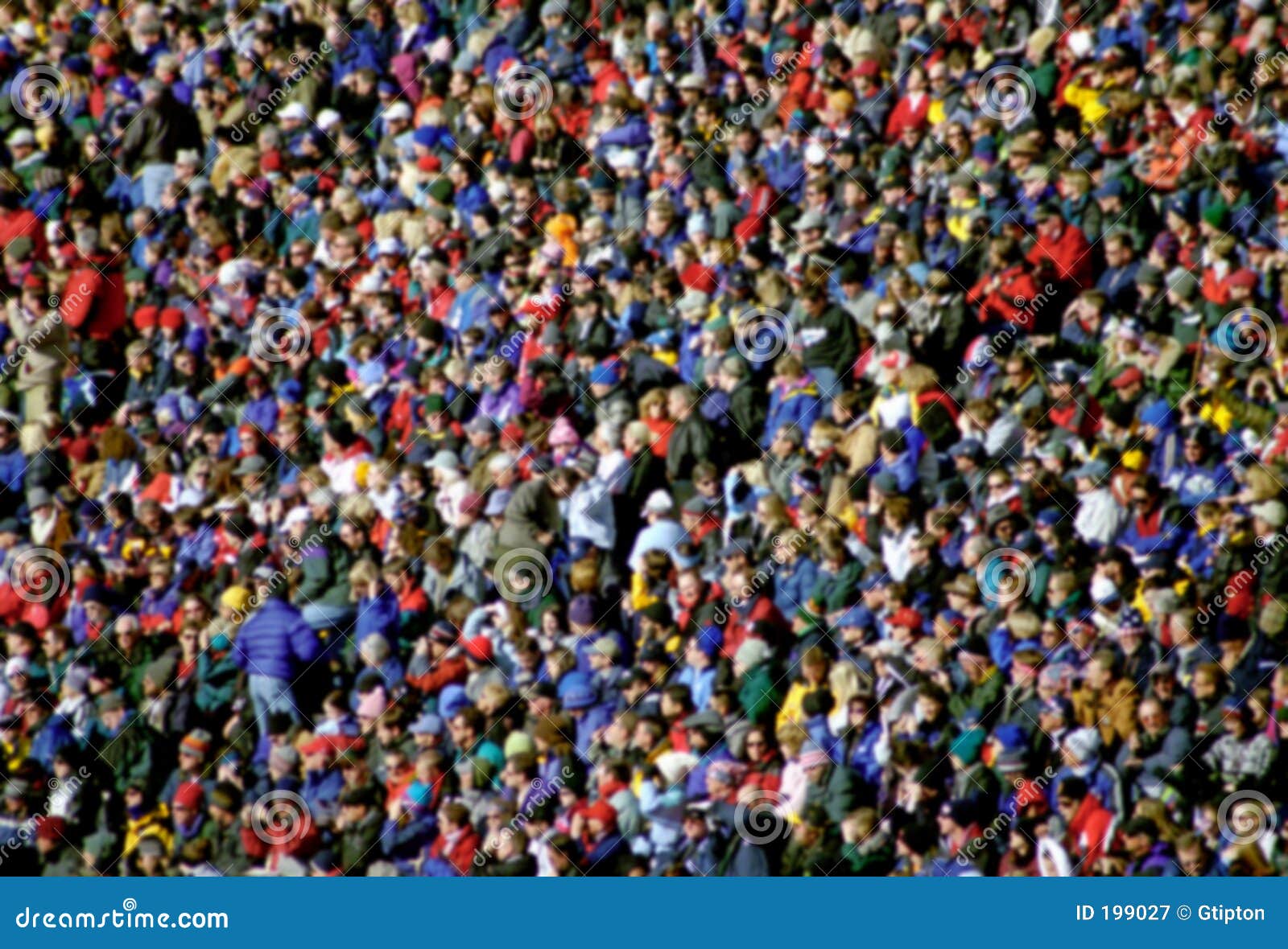 Close-up Of A Diverse Group Of People Standing On A Sandy Beach Near A ...