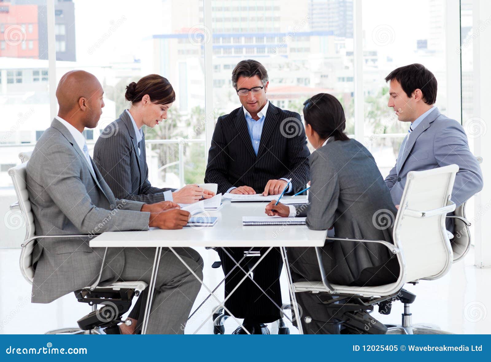 A Diverse Business Group Discussing a Budget Plan Stock Image - Image ...