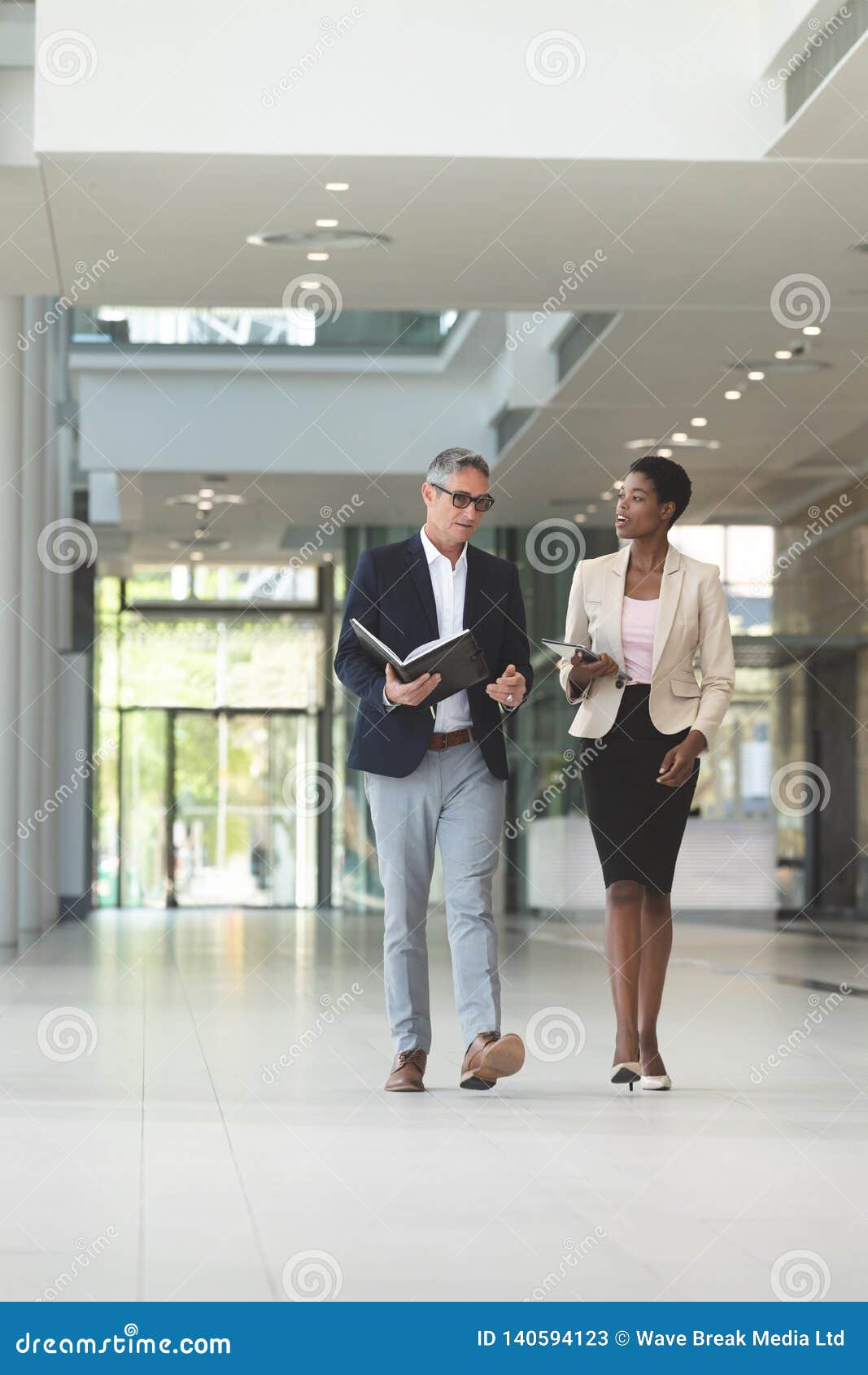 Diverse Business People Interacting with Each Other while Walking in ...