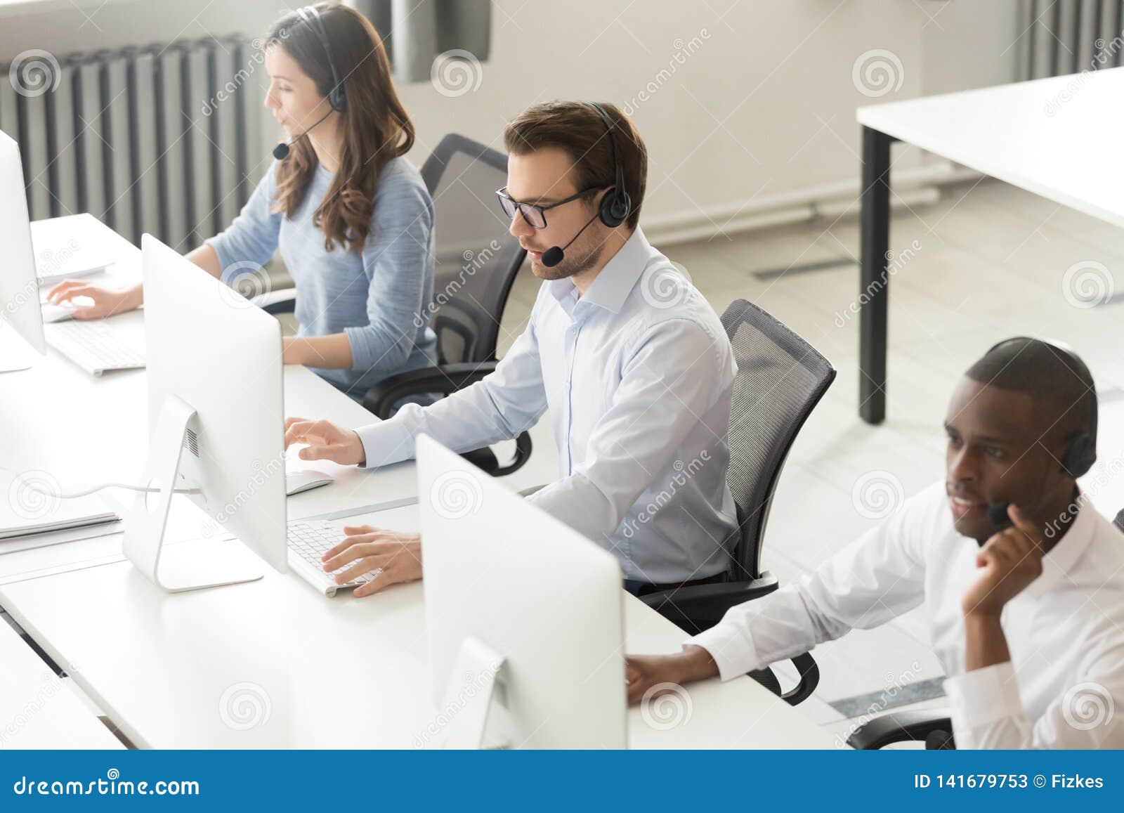 Diverse Call Center Operators Team Working on Computers in Office Stock ...