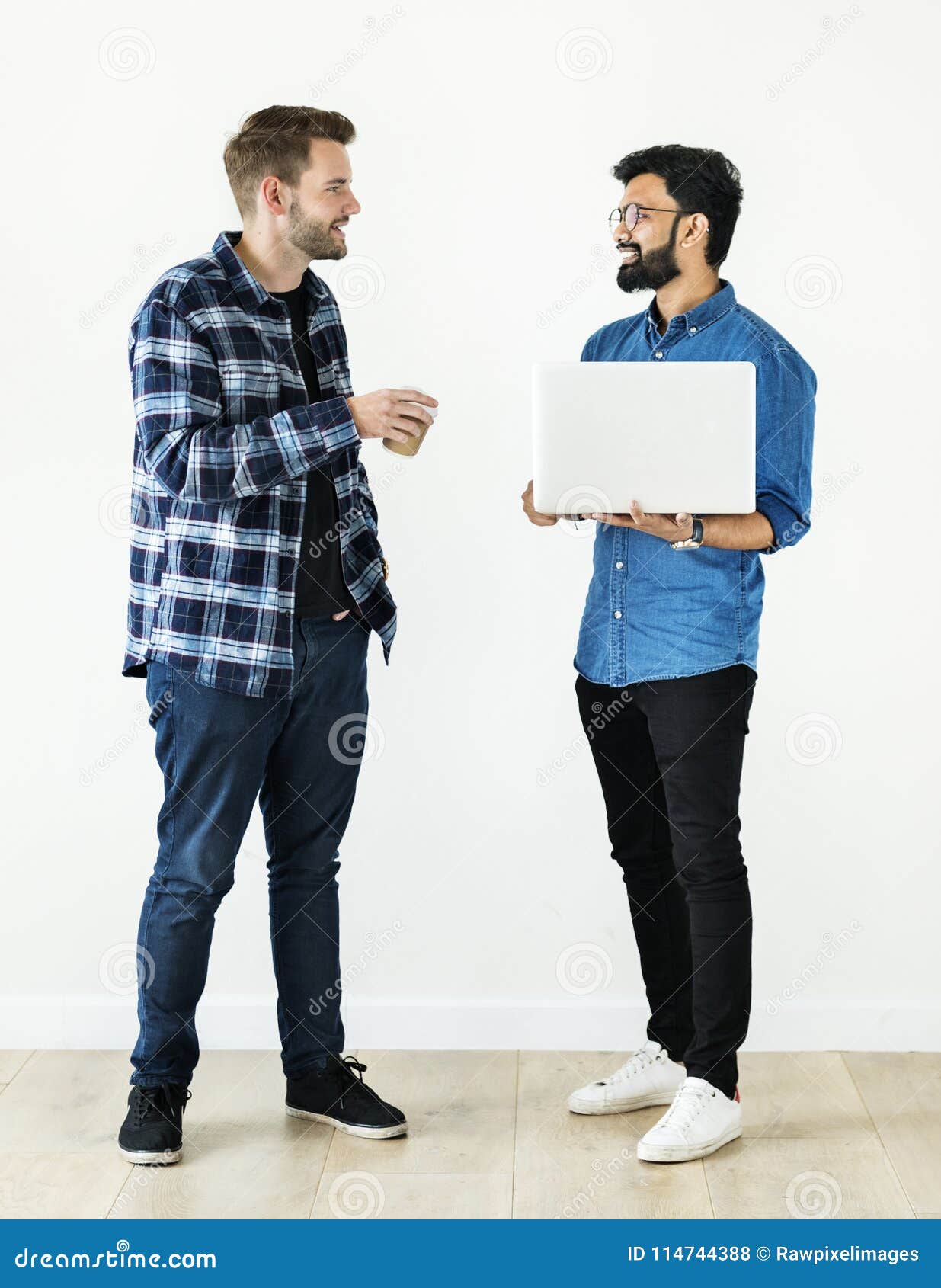 Two Men Standing And Talking Two Men Standing And Talking