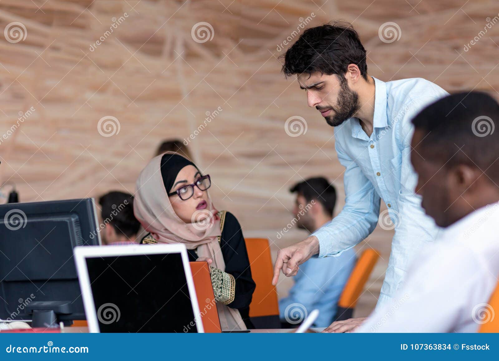 Diverse College Students Using Laptop and Talking, Learning Exchanging ...