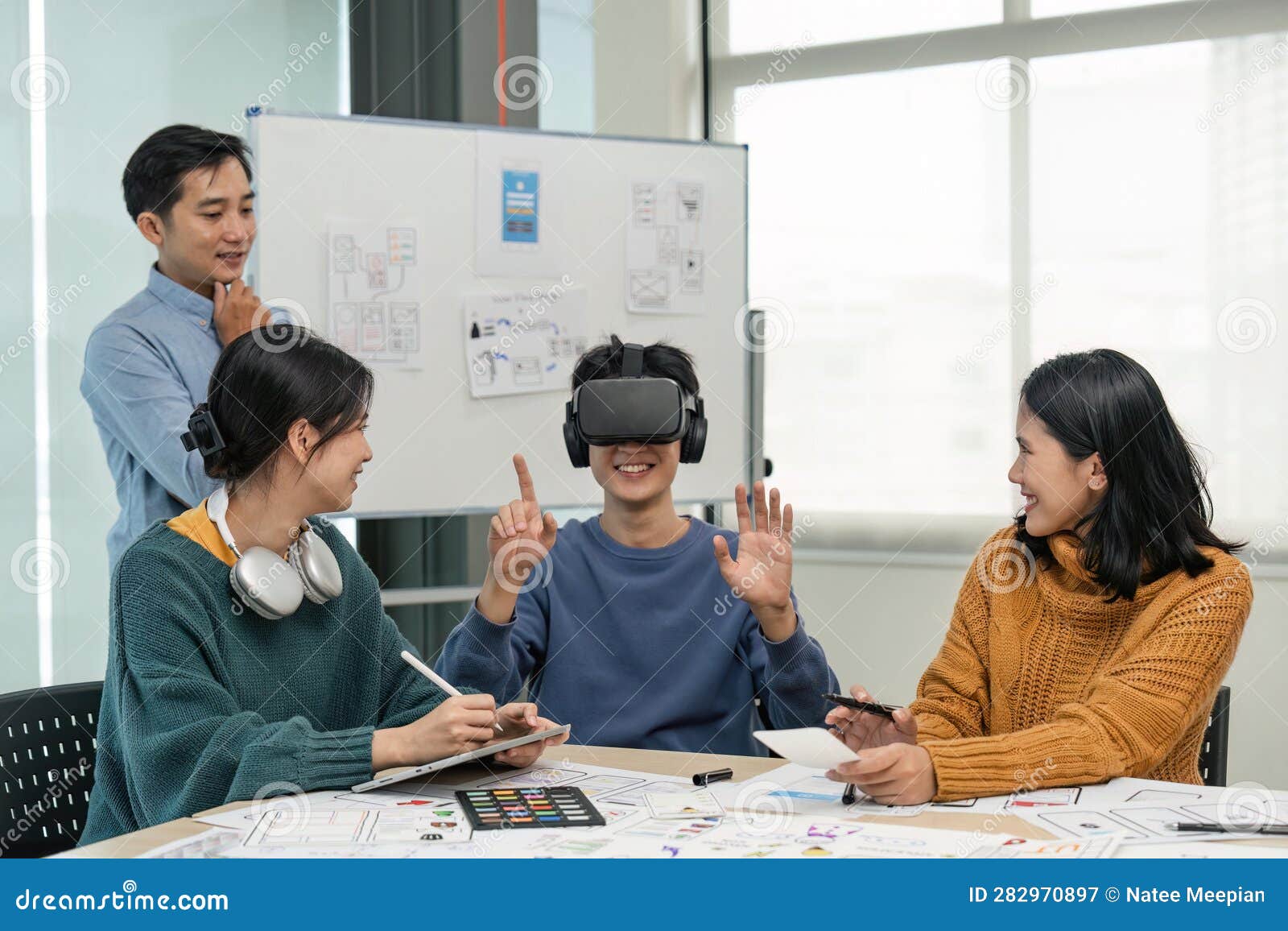 Diverse Development Team Testing Virtual Reality Headset, Brainstorming ...