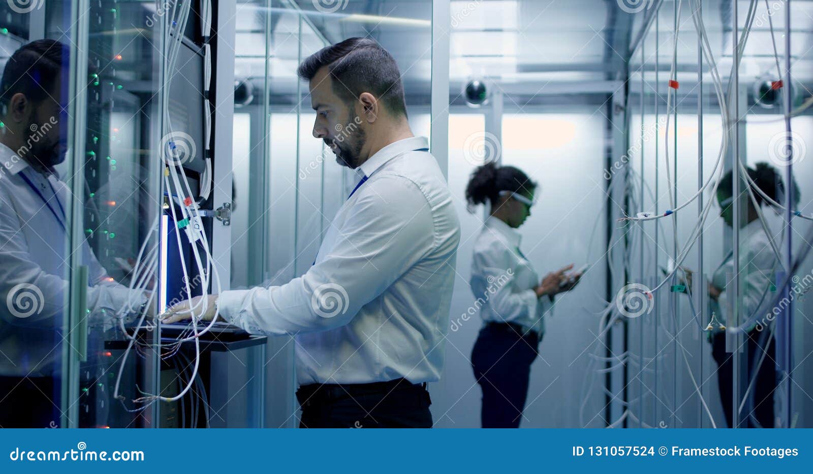 Engineers Work with Cables in the Server Room Stock Photo - Image of ...