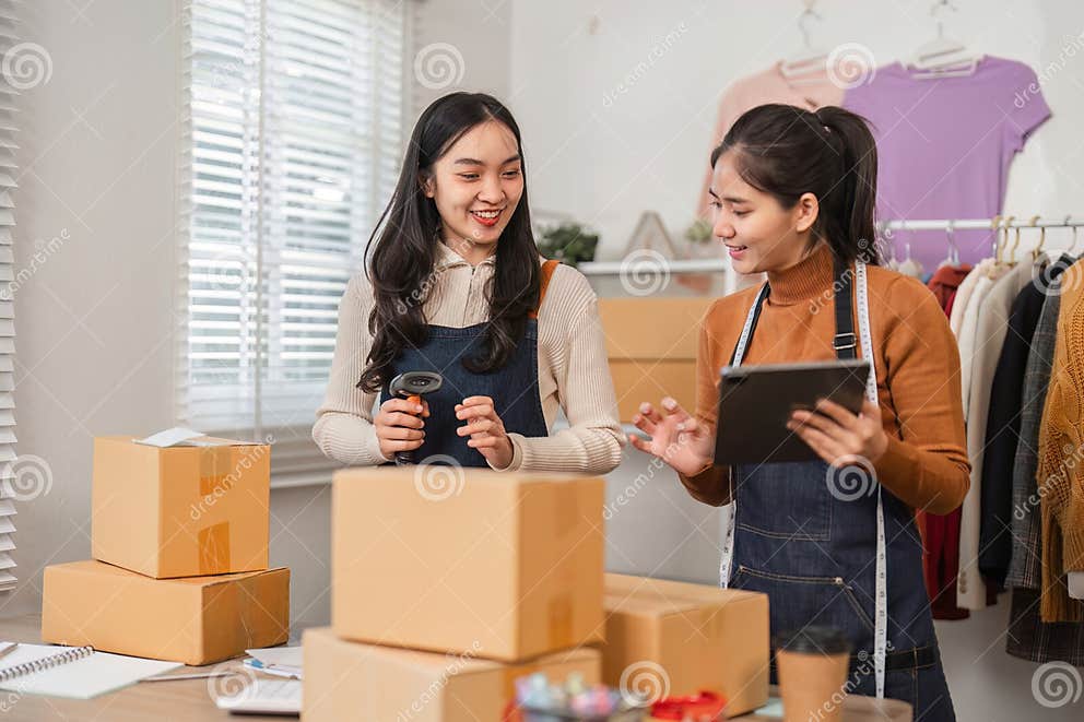 Diverse Female E-commerce Employees Scanning Packages and Checking Inventory in Retail Store ...