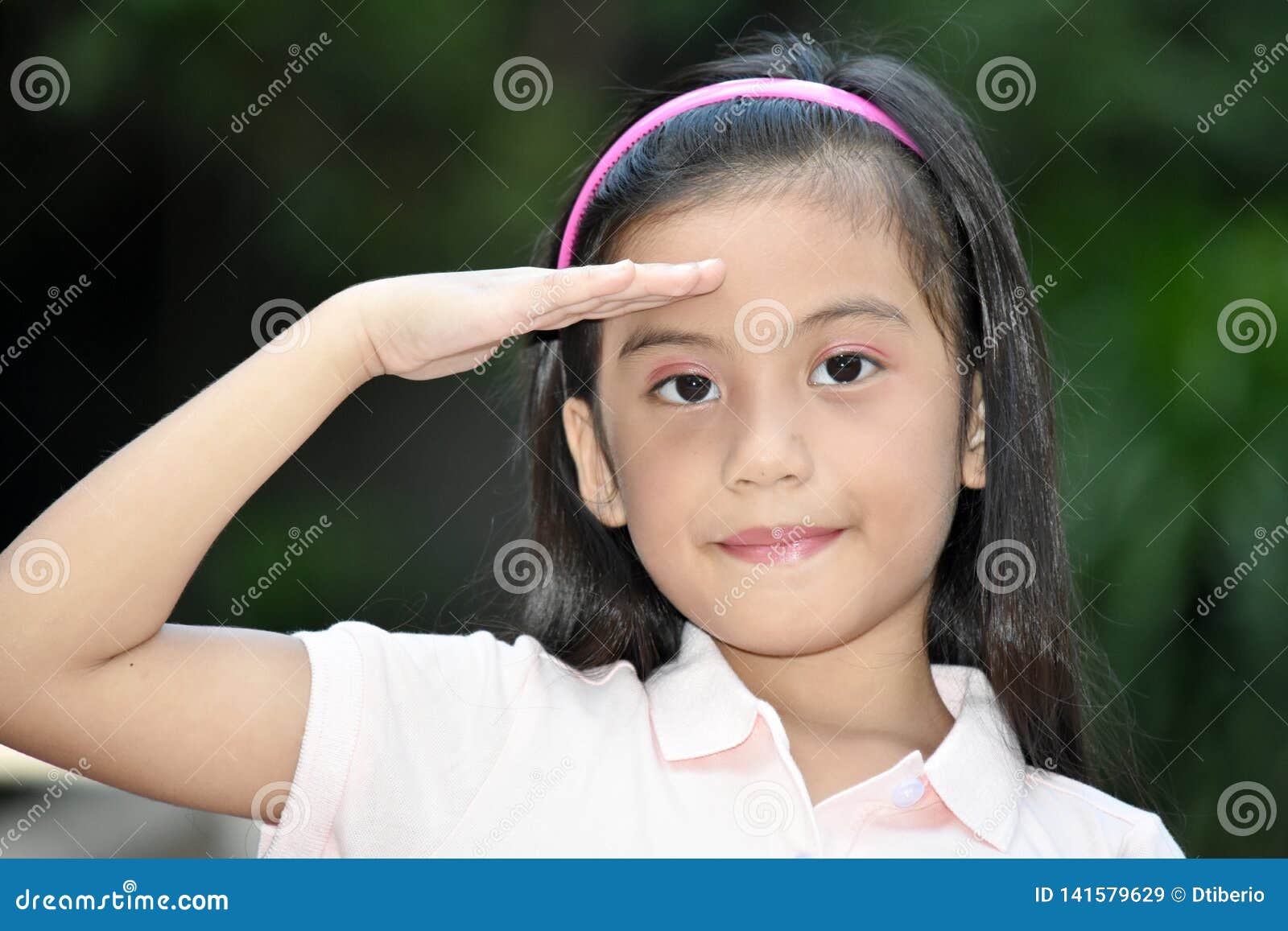 A Diverse Girl Saluting stock image. Image of adorable - 141579629