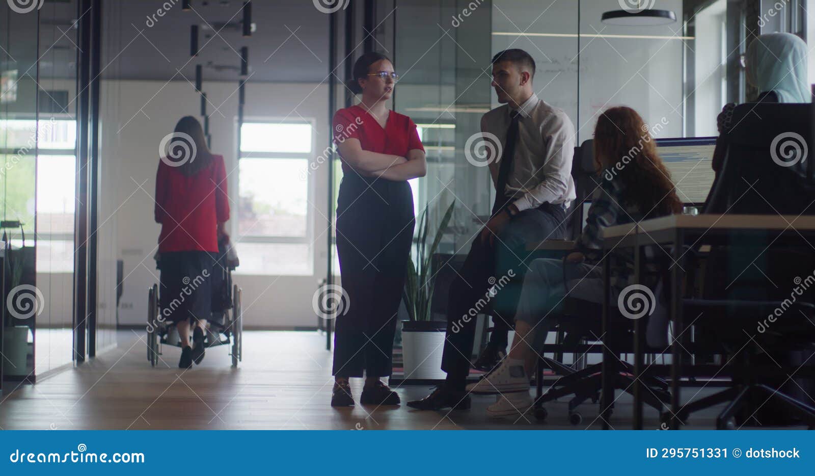 A Diverse Group of Business Colleagues Engage in Discussions about ...