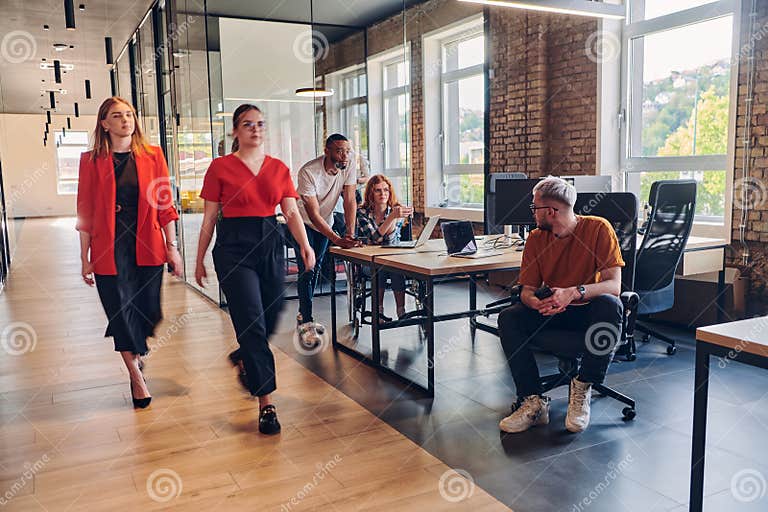 A Diverse Group of Business Professionals Collaborates in a Modern ... A Diverse Group of Business Professionals Collaborates in a Modern ...