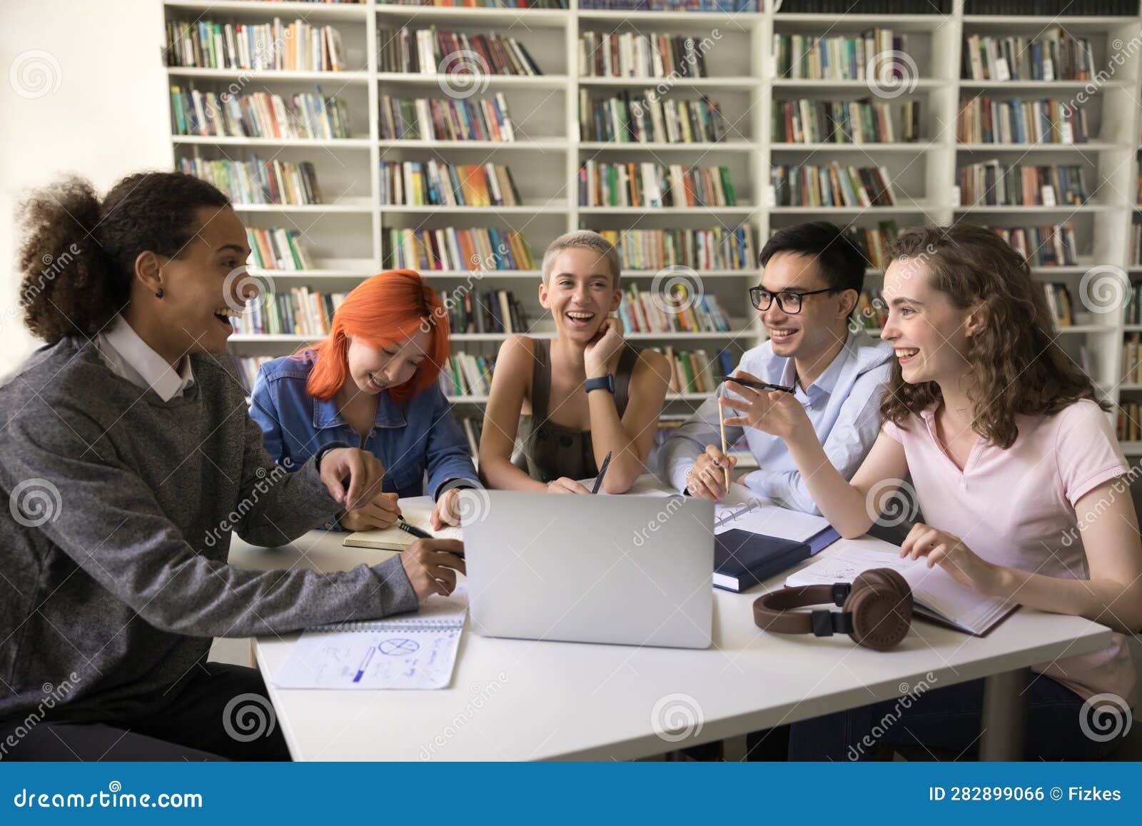 Diverse Group of Cheerful Classmates Brainstorming on Common Studying ...