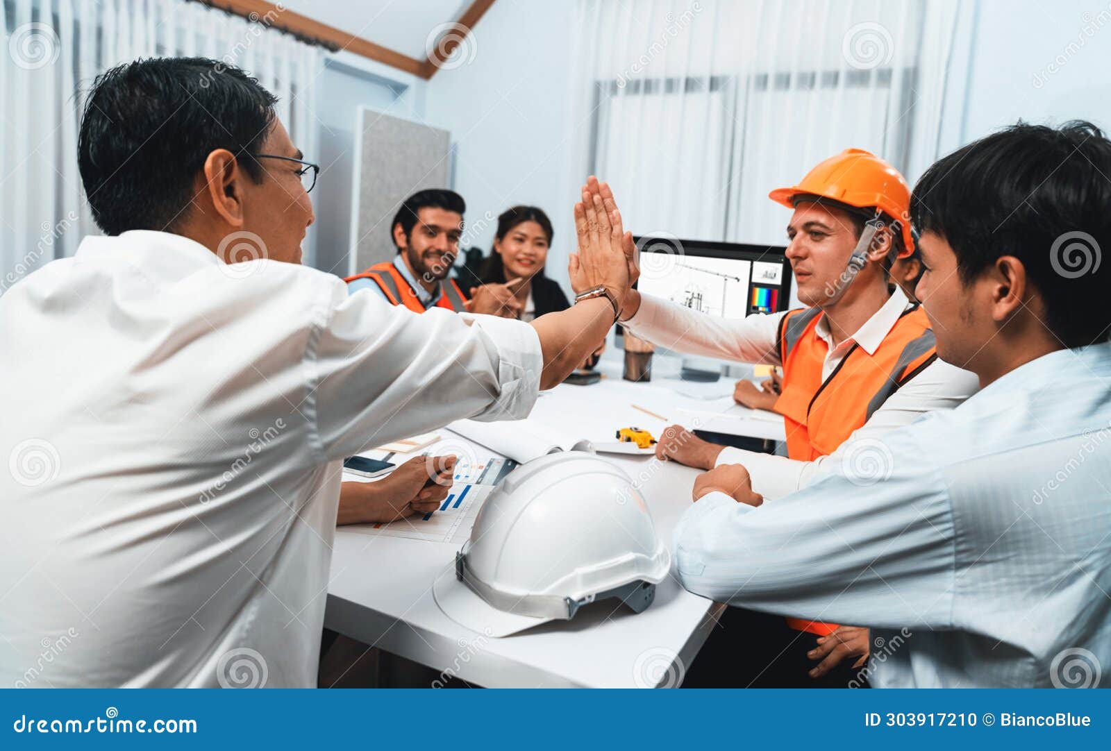 Diverse Group of Civil Engineer and Client Celebrate and High Five ...