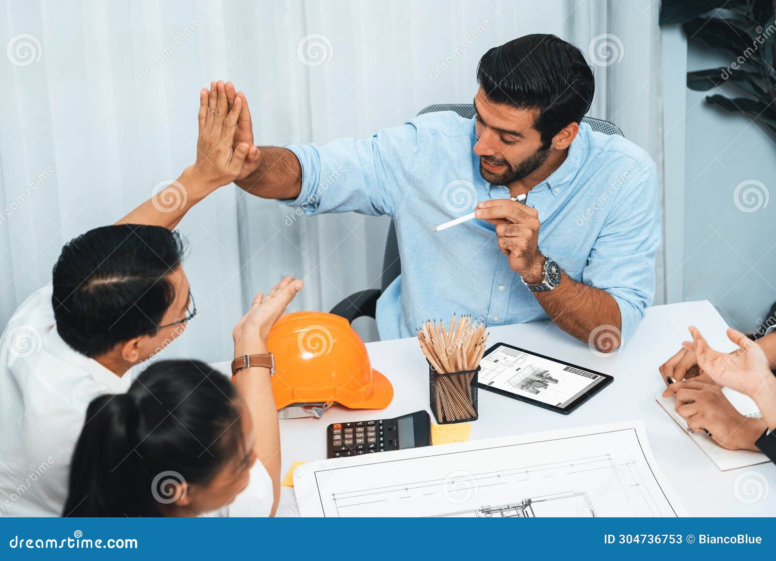 Diverse Group of Civil Engineer and Client Celebrate and High Five ...