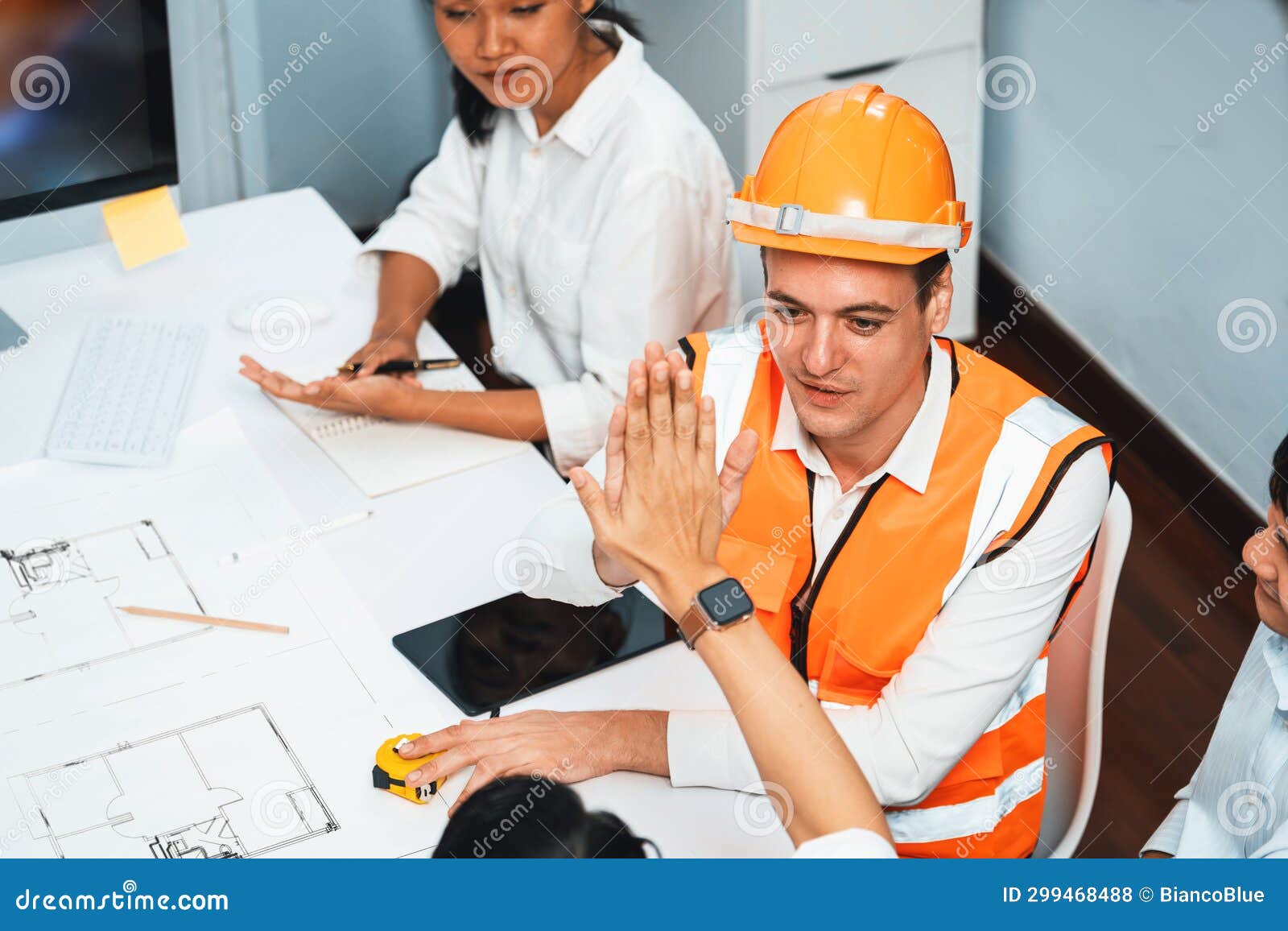 Diverse Group of Civil Engineer and Client Celebrate and High Five ...