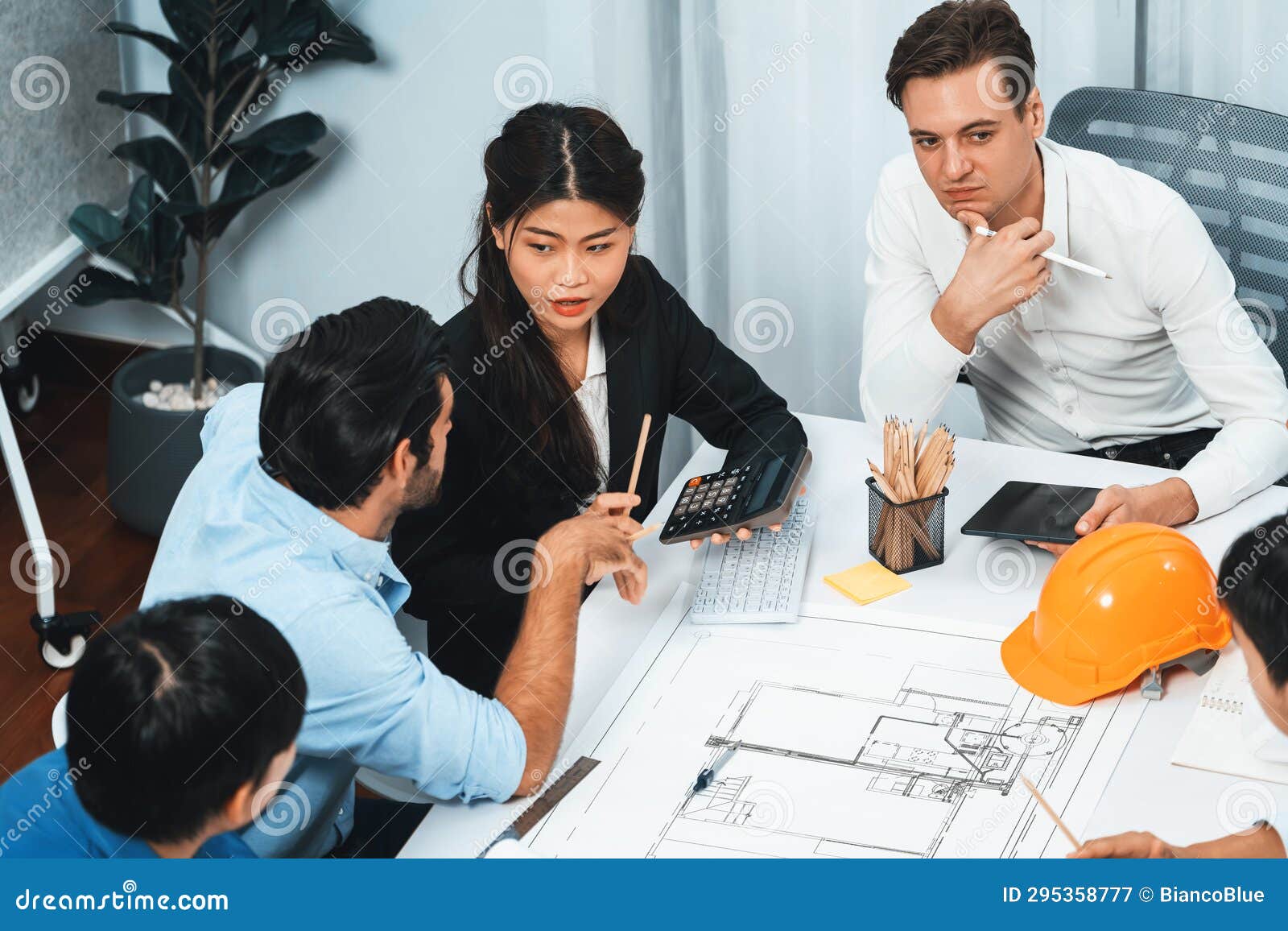 Diverse Group of Civil Engineer and Client Working on Architect ...