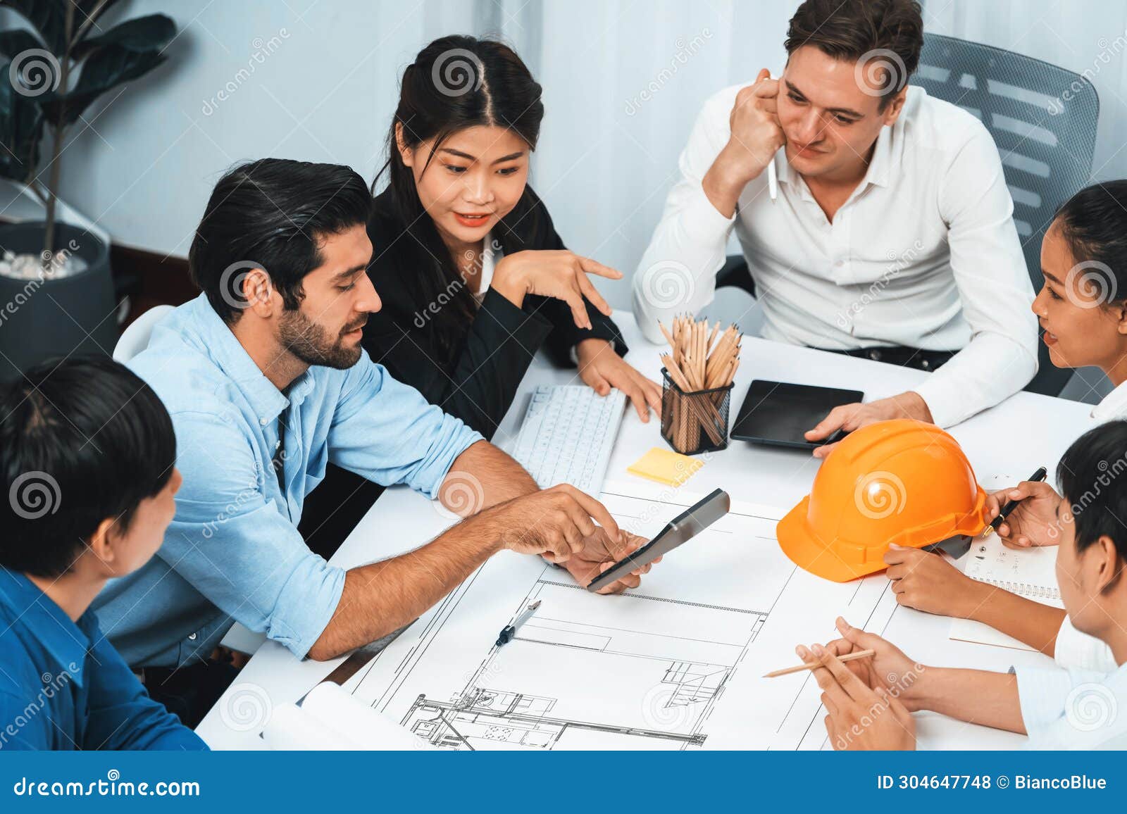 Diverse Group of Civil Engineer and Client Working on Architect ...