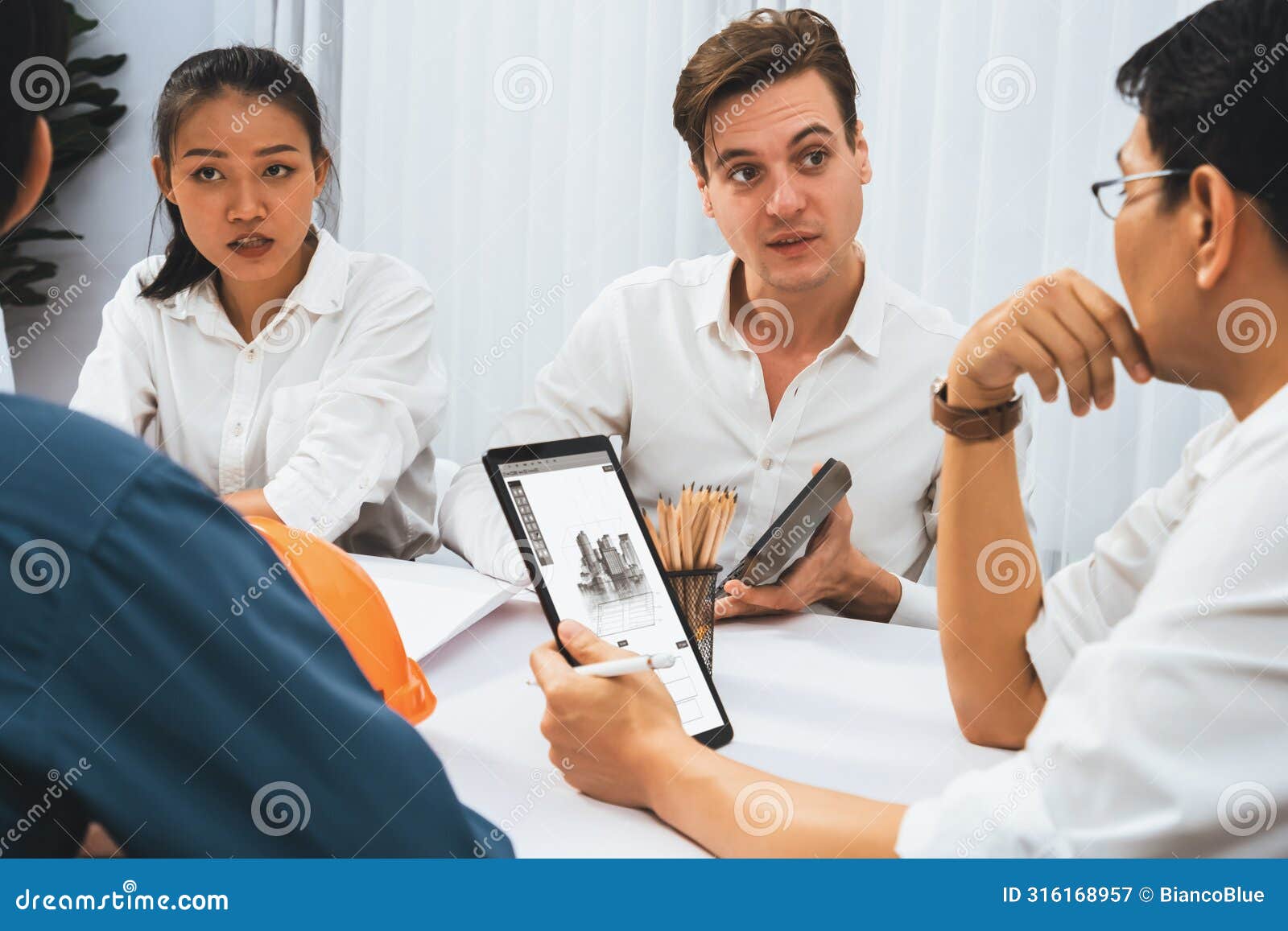 Diverse Group of Civil Engineer and Client Working on Architect ...