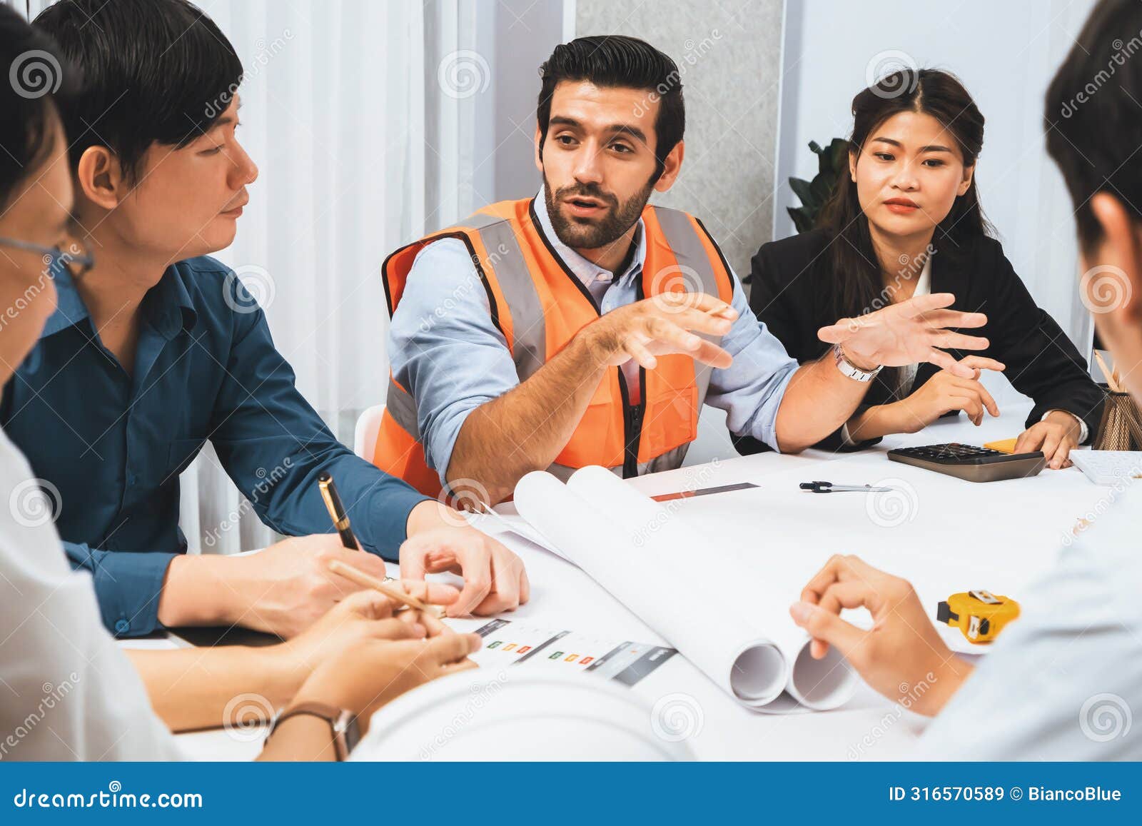 Diverse Group of Civil Engineer and Client Working on Architect ...