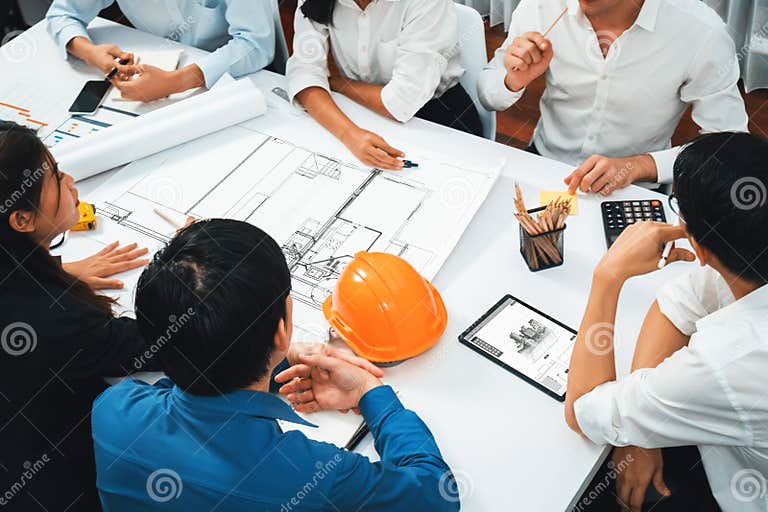 Diverse Group of Civil Engineer and Client Working on Architect ...
