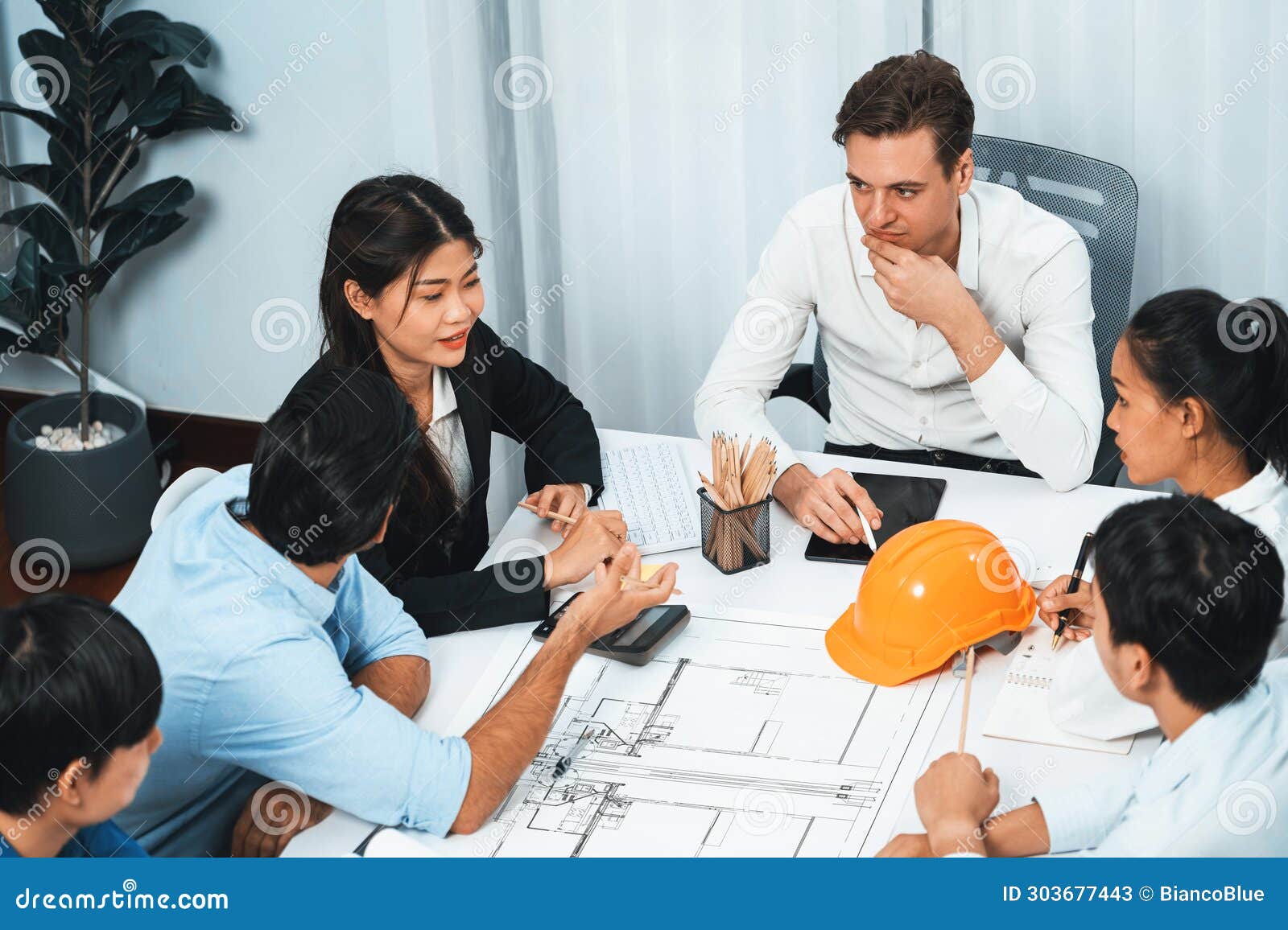 Diverse Group of Civil Engineer and Client Working on Architect ...
