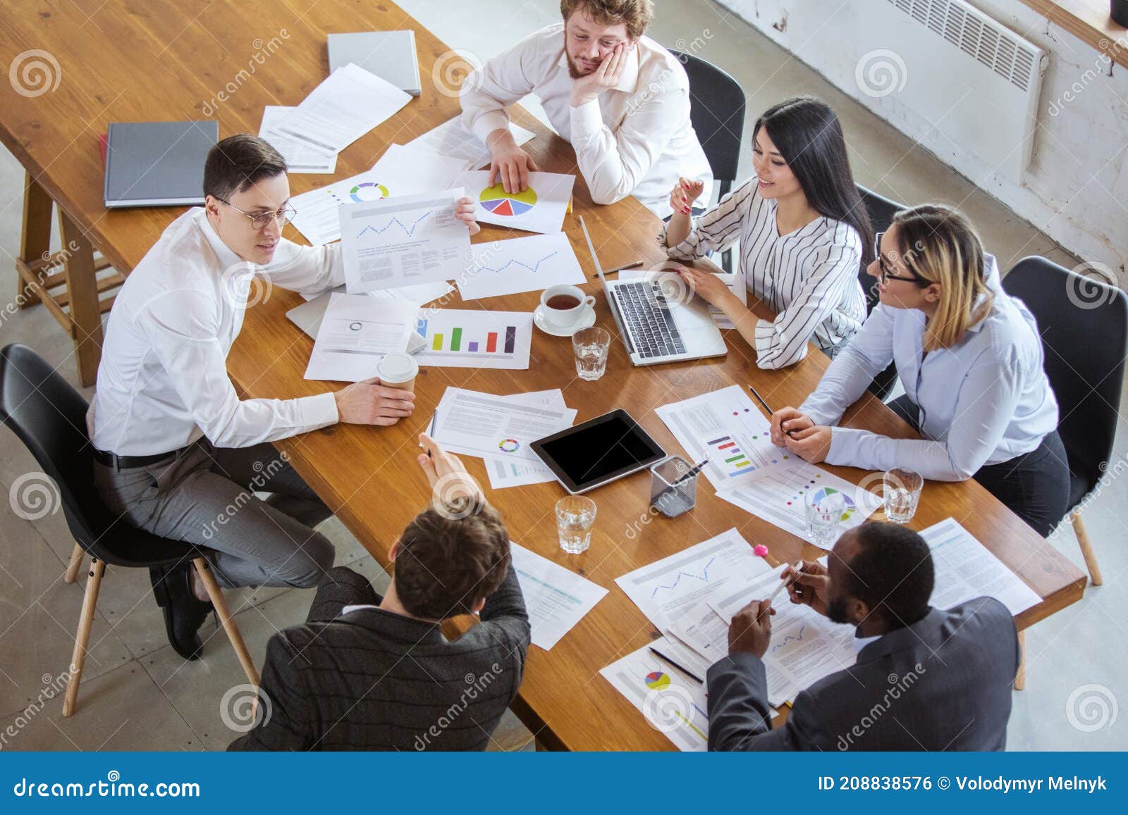 Diverse Group of Co-workers Having Casual Discussion in Office ...
