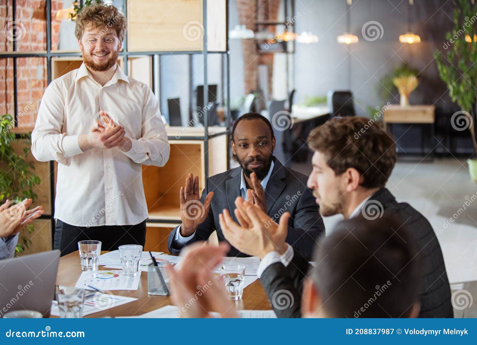 Diverse Group of Co-workers Having Casual Discussion in Office ...