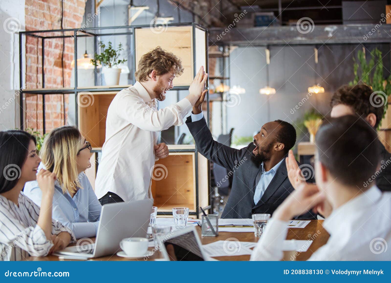 Diverse Group of Co-workers Having Casual Discussion in Office ...