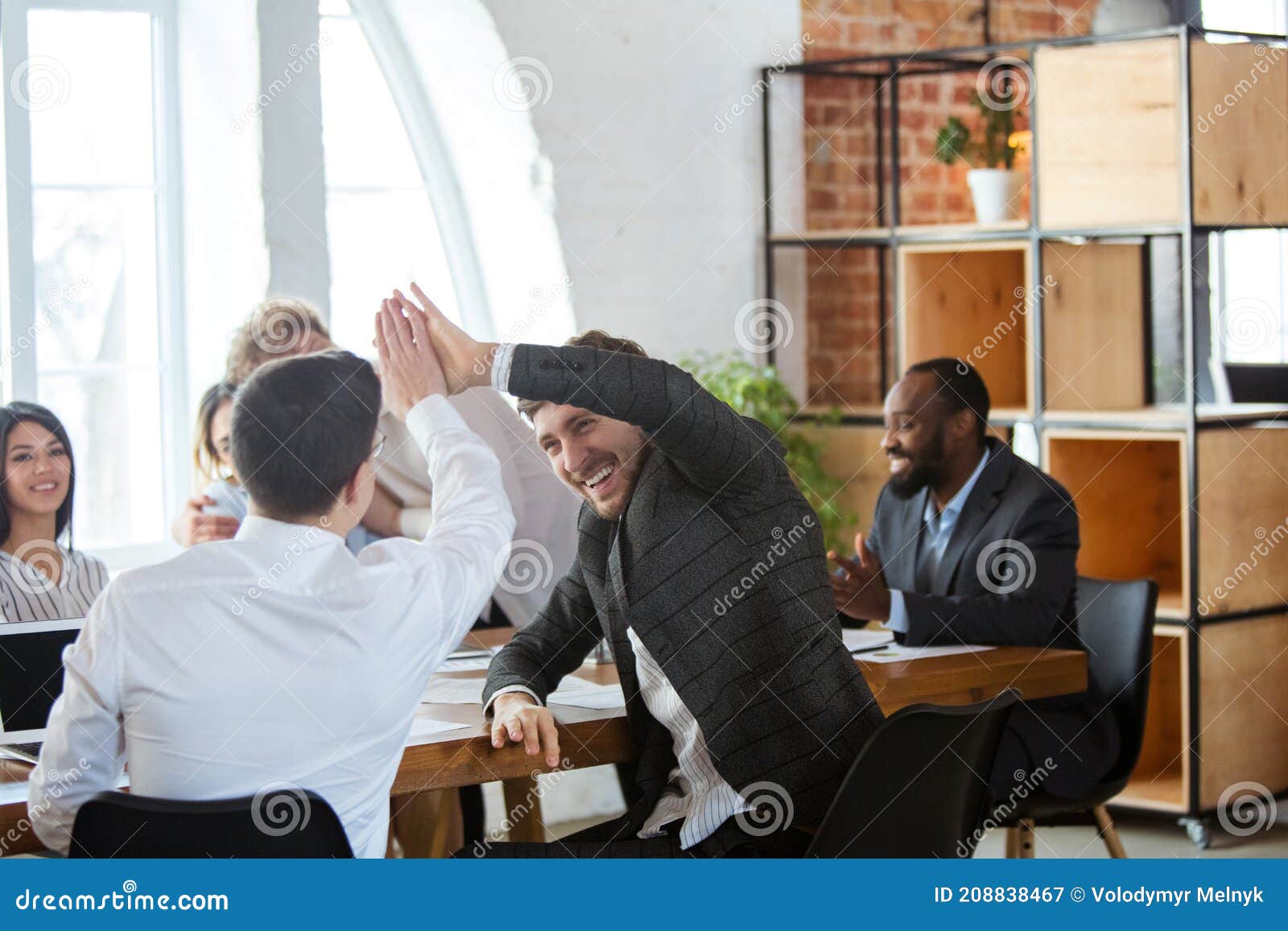 Diverse Group of Co-workers Having Casual Discussion in Office ...