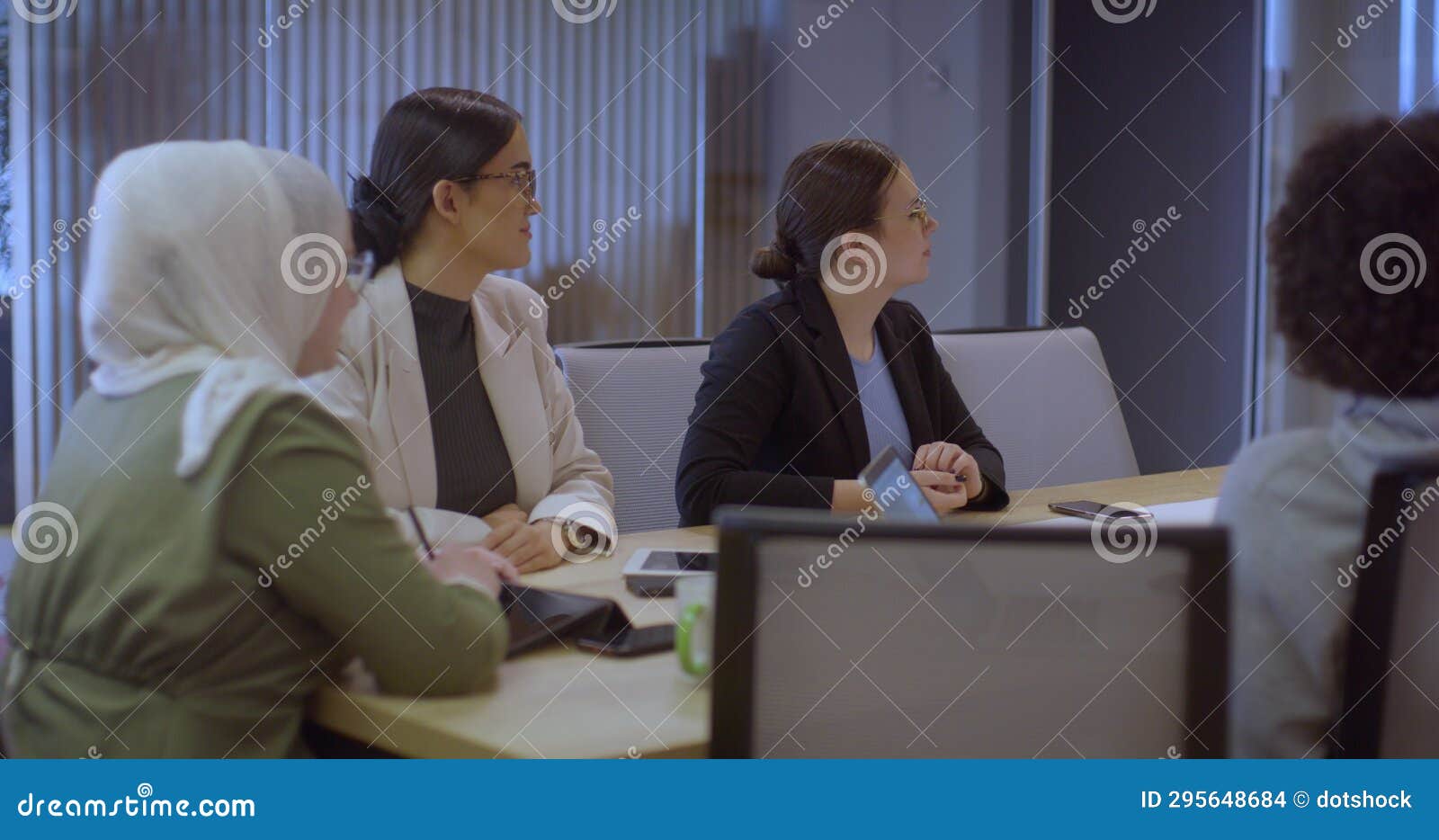 A Diverse Group of Colleagues Exchange Business Experiences, Engage in ...