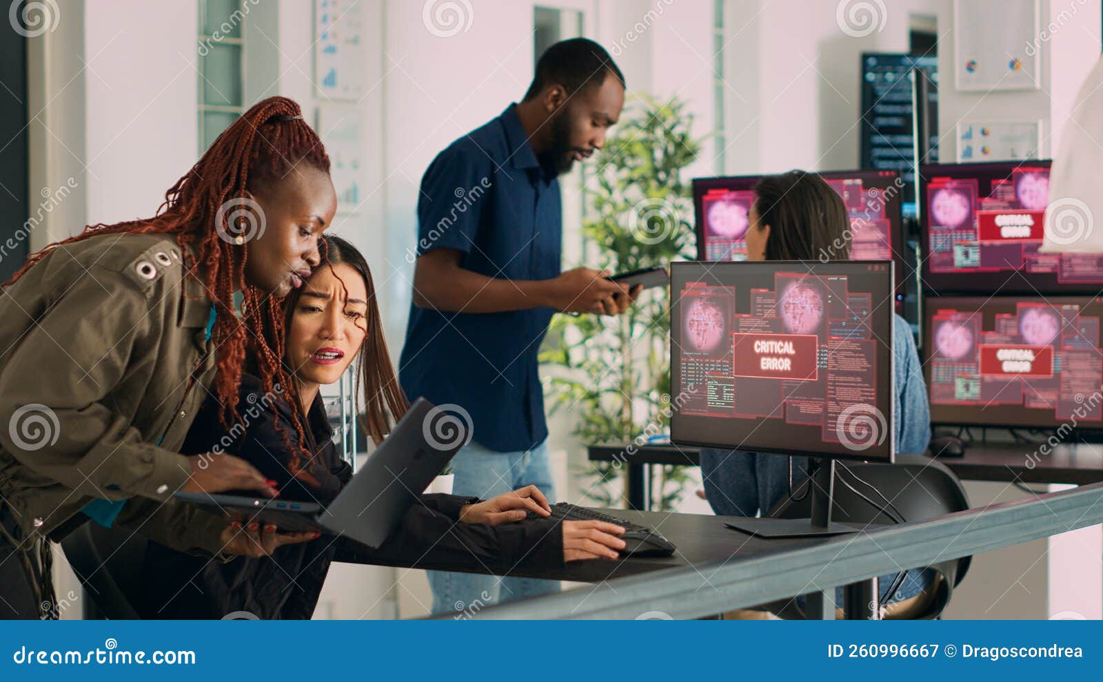 Diverse Group Of Engineers Having Computer Hacked And System Crash On Multiple Monitors Stock