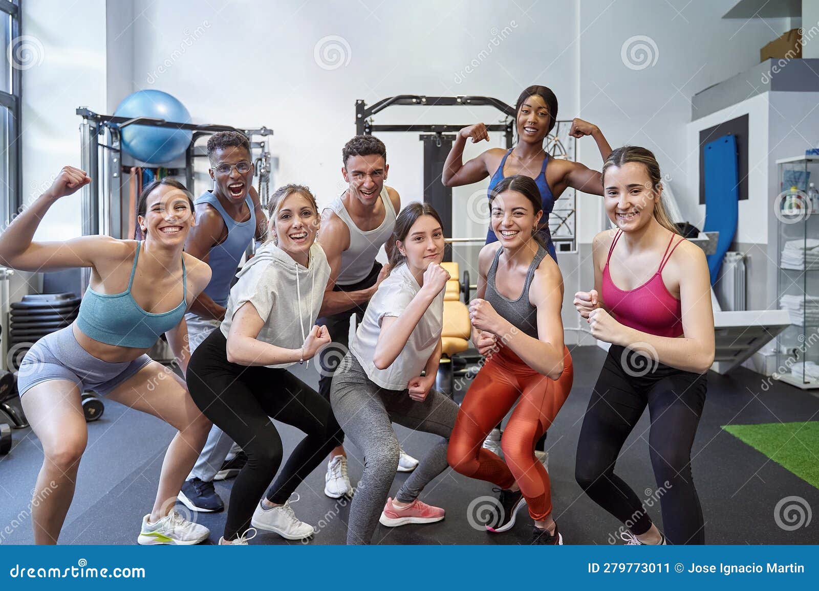 Multicultural Group of Friends at Gym, Flexing Muscles and Smiling for ...